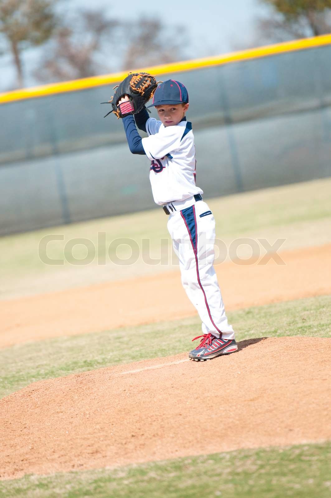 Little league pitcher starting his wind up | Stock image | Colourbox