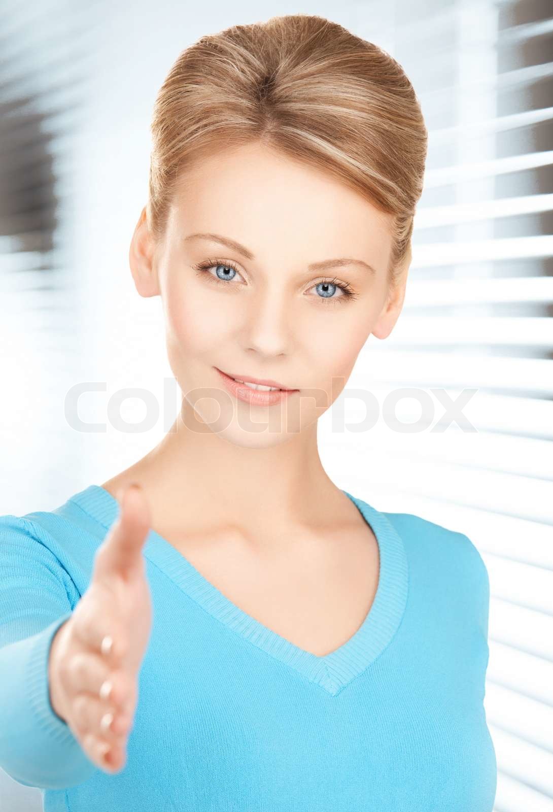 woman with an open hand ready for handshake | Stock image | Colourbox