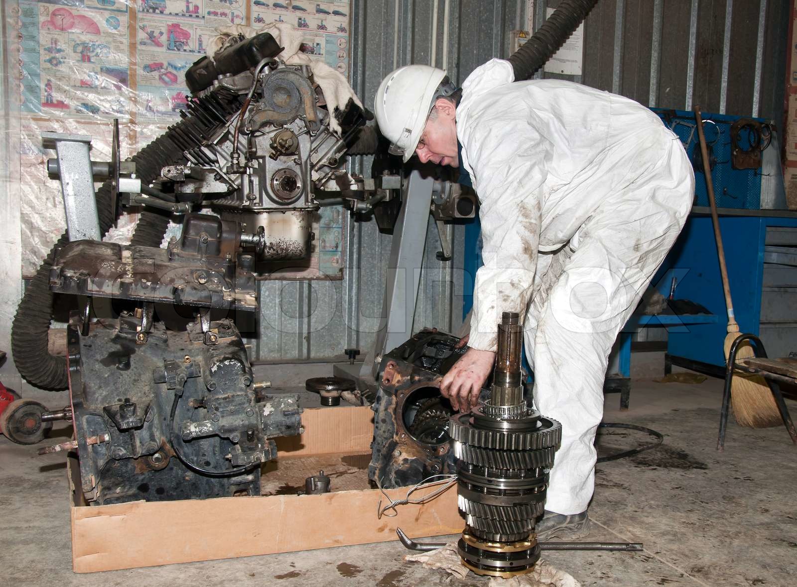 the mechanic behind work in garage | Stock image | Colourbox