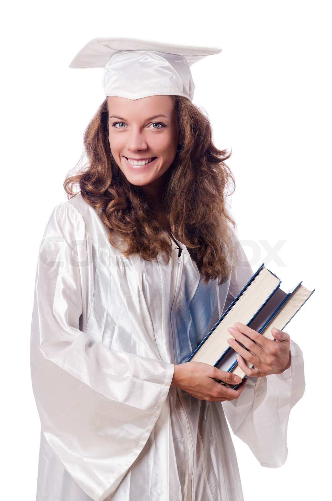 Absolvent mit Buch isoliert auf weiß | Stock Bild | Colourbox