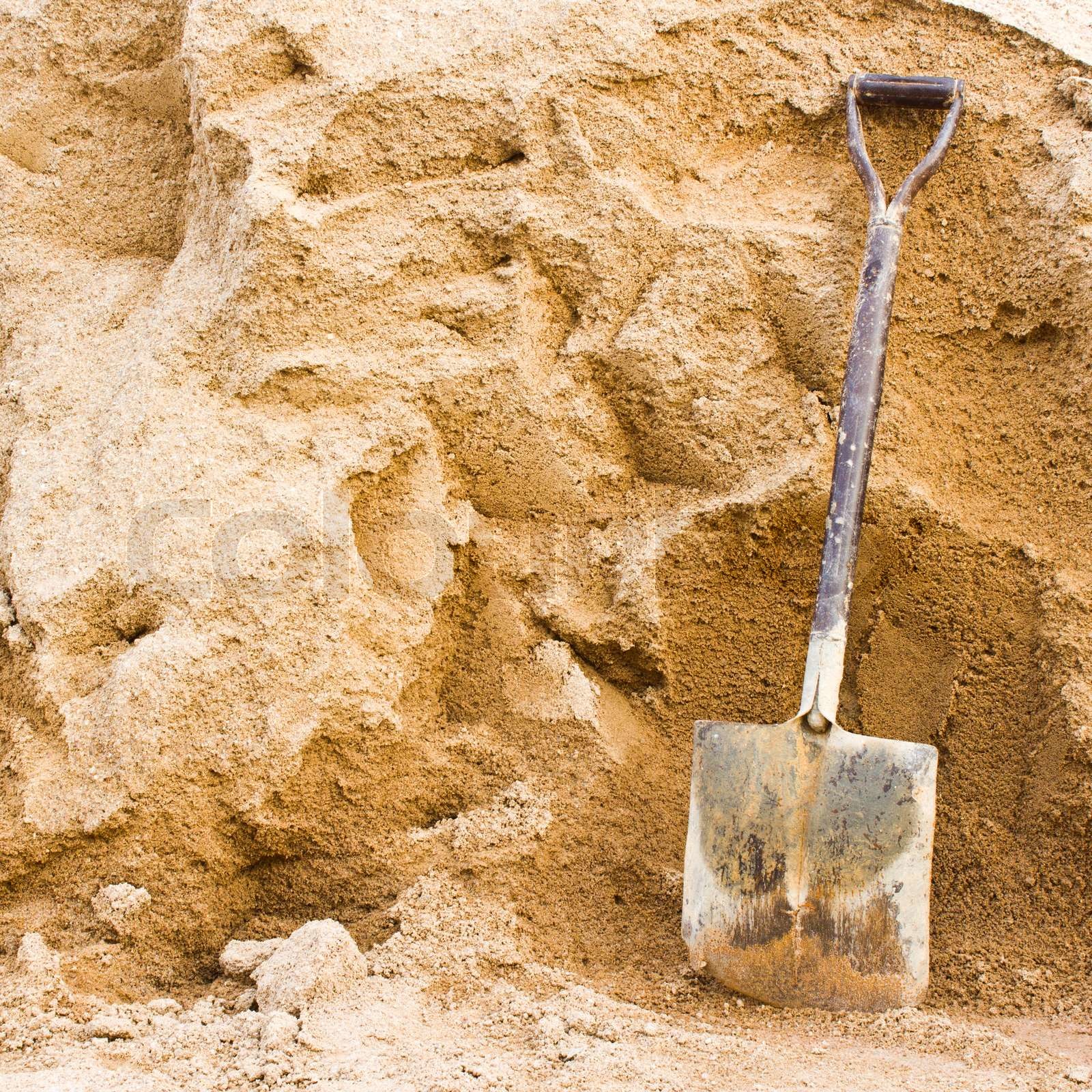 Shovel sand for construction,A shovel in a sand | Stock image | Colourbox