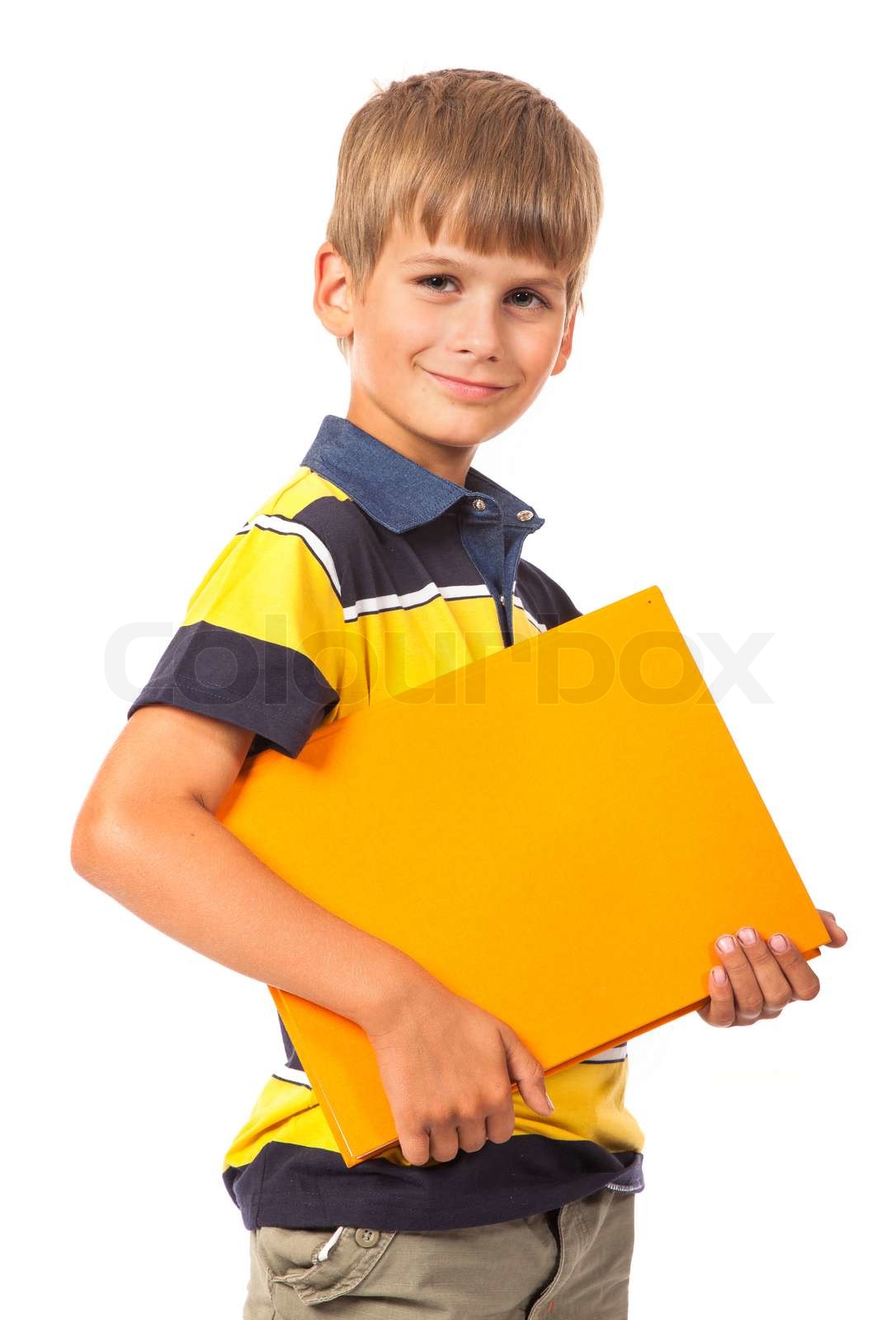 School boy is holding a book | Stock image | Colourbox