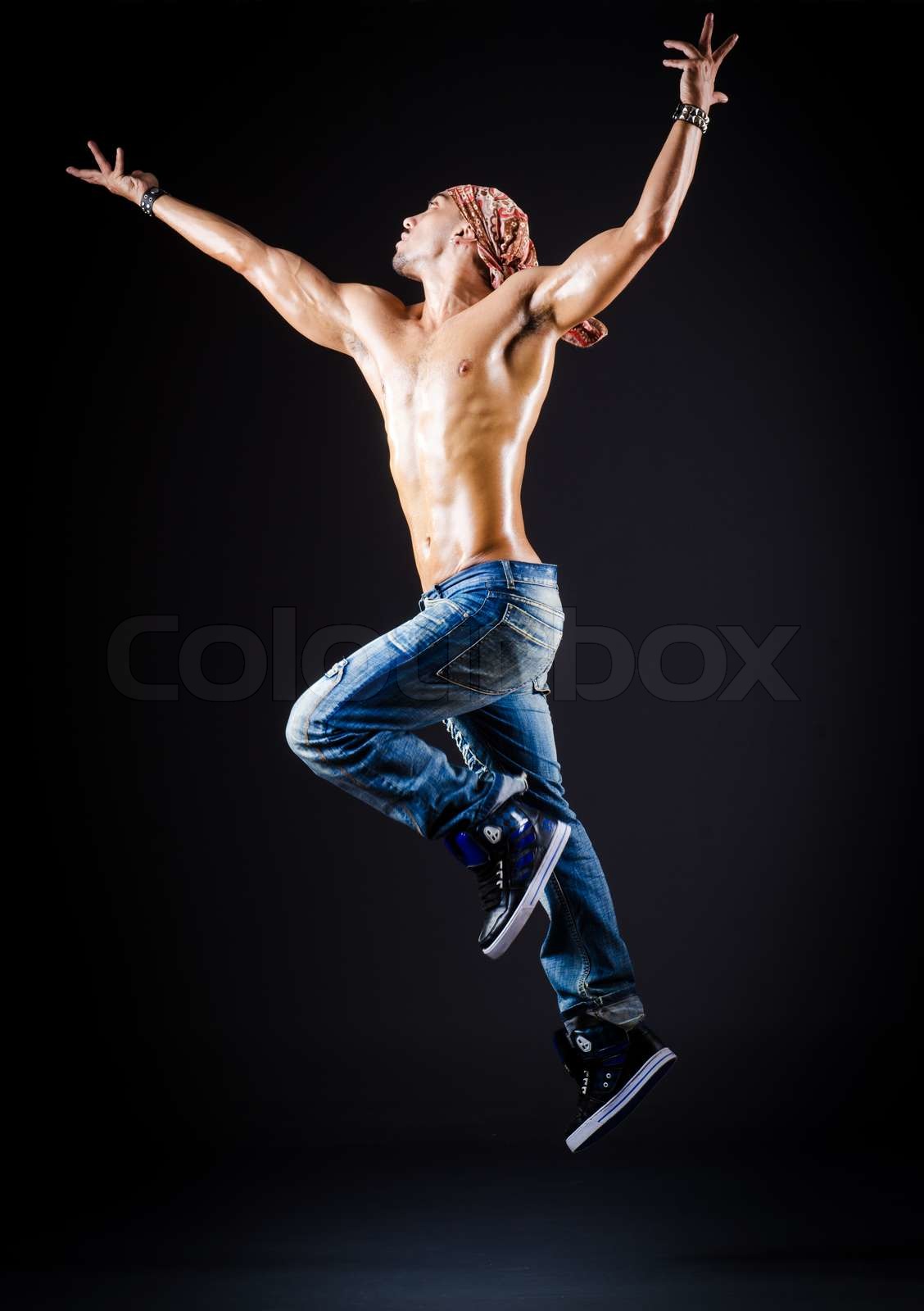 Dancer dancing in dark room | Stock image | Colourbox
