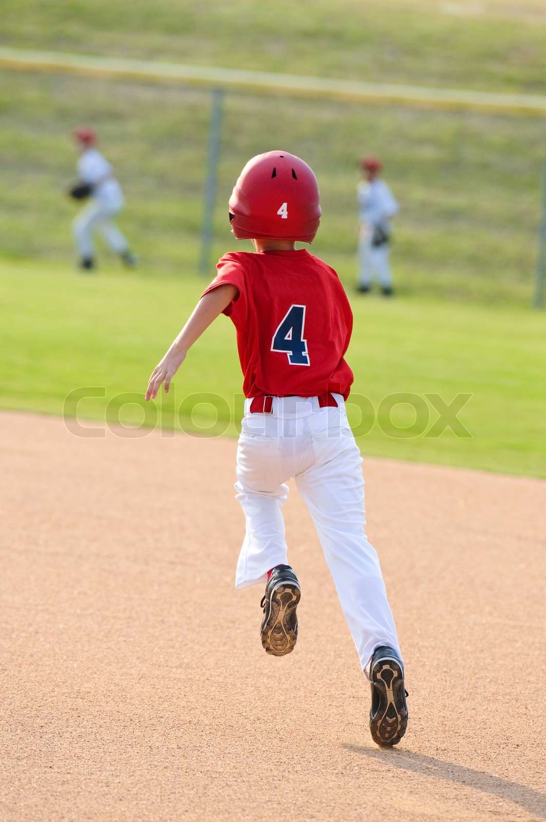 Baseball boy running bases | Stock image | Colourbox