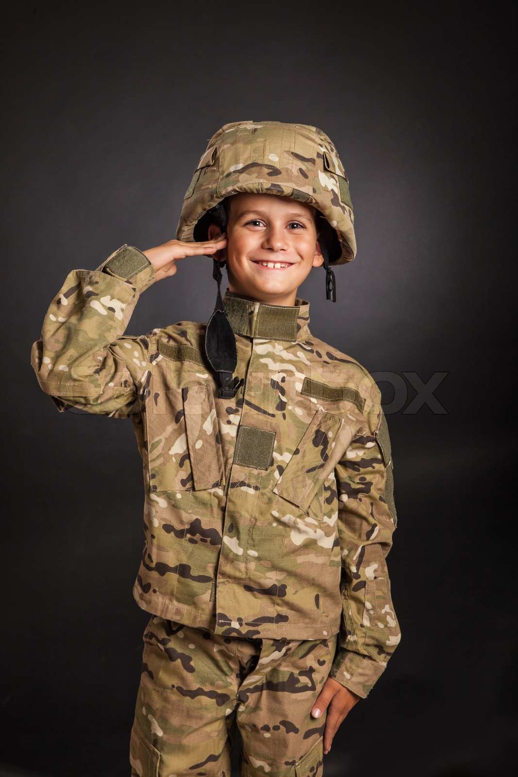 Saluting soldier Young boy dressed like a soldier | Stock image | Colourbox