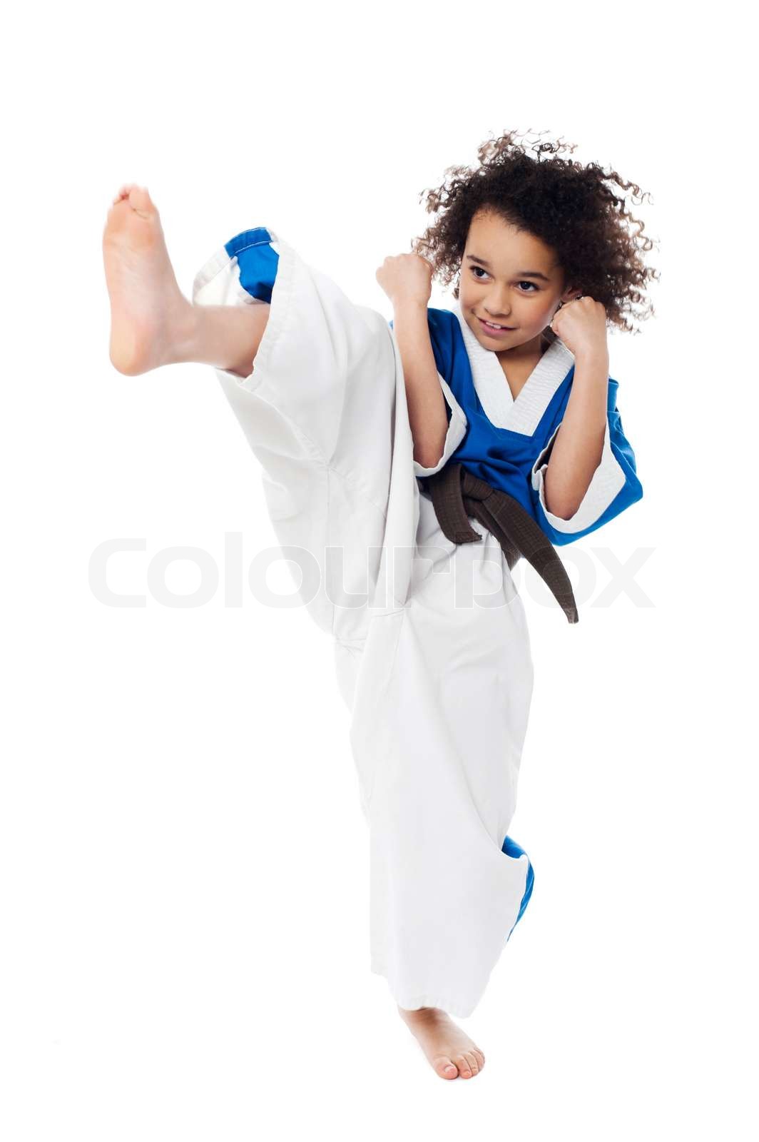 Young kid practicing karate | Stock image | Colourbox