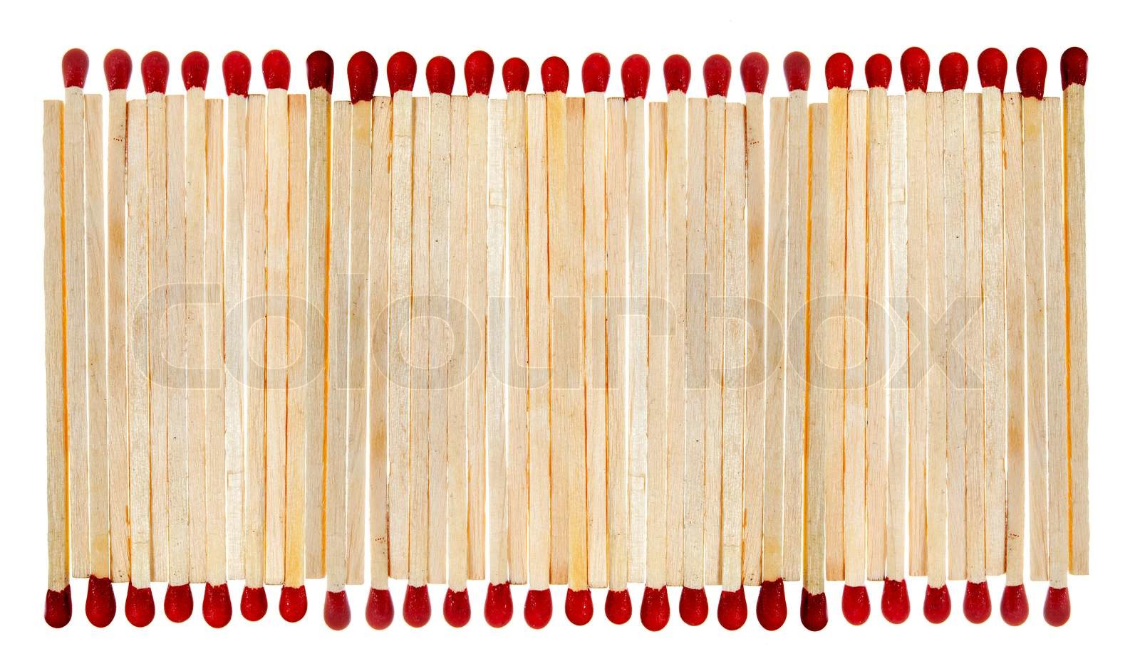 Match sticks in a row isolated on white | Stock image | Colourbox
