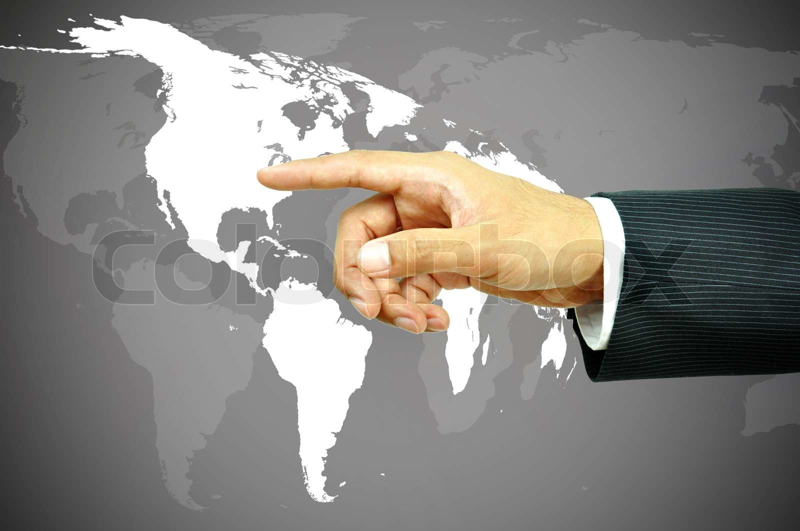Businessman hand touching world map | Stock image | Colourbox Businessman hand touching world map | Stock image | Colourbox