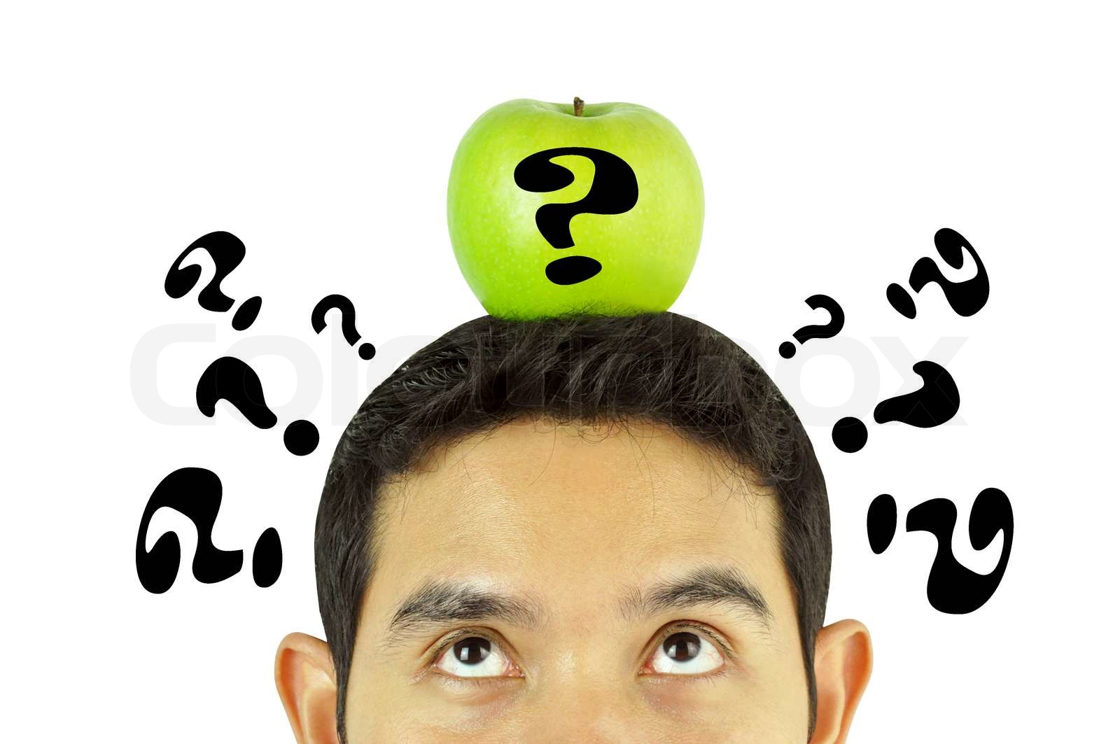 A man thinking with apple on the head | Stock image | Colourbox