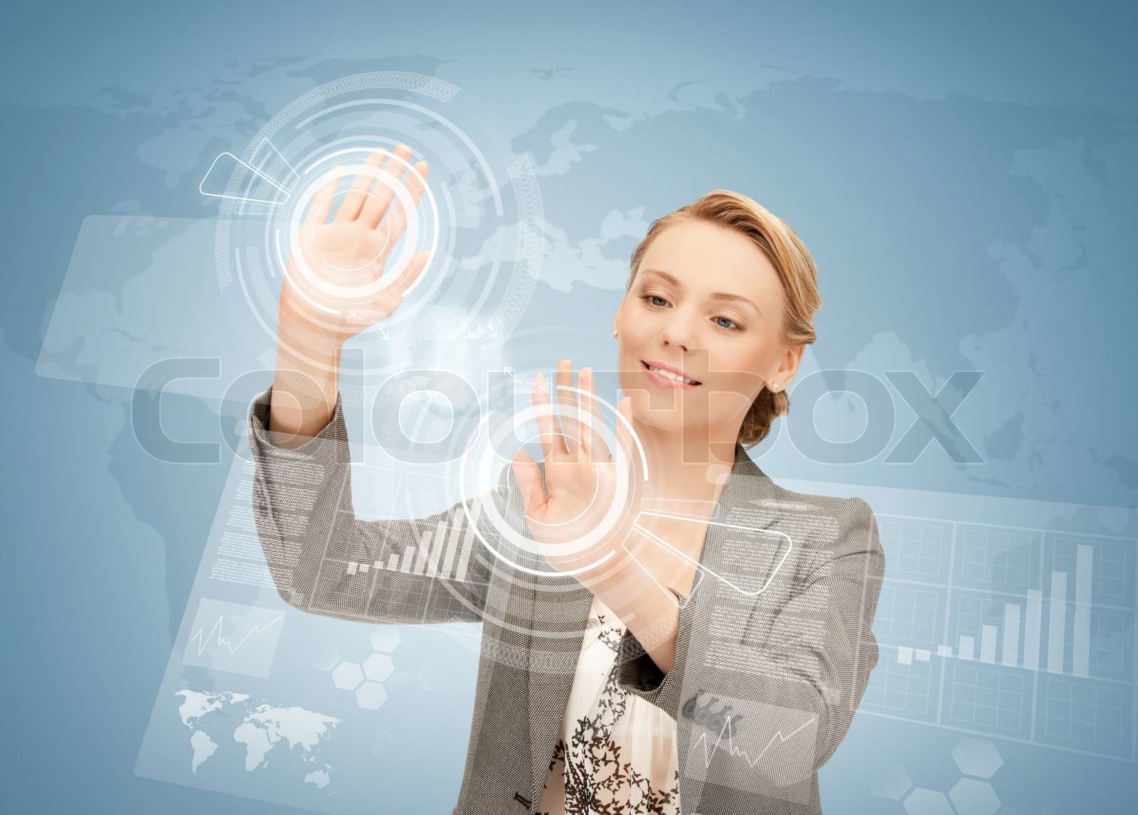 businesswoman touching virtual screen | Stock image | Colourbox