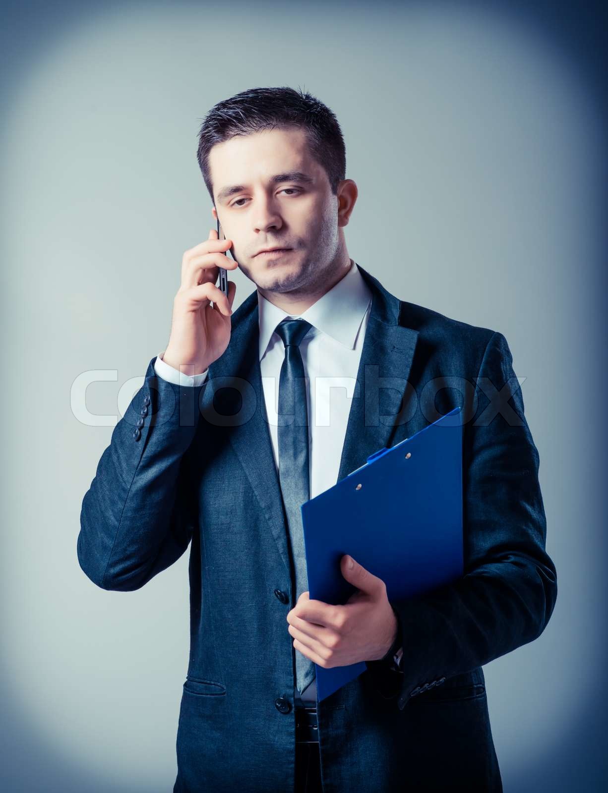 Business man with a clipboard | Stock image | Colourbox