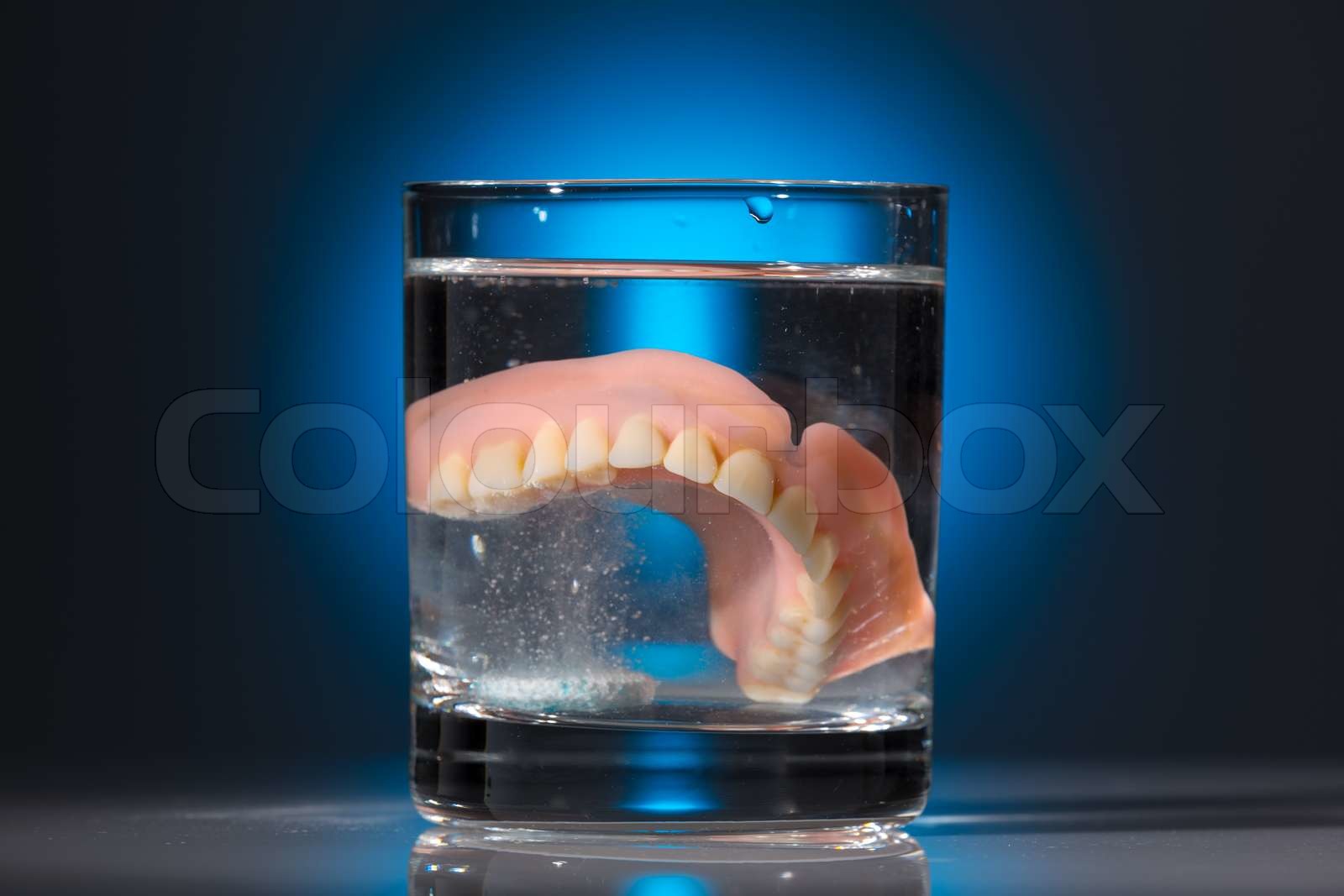 dentures in a water glass | Stock image | Colourbox