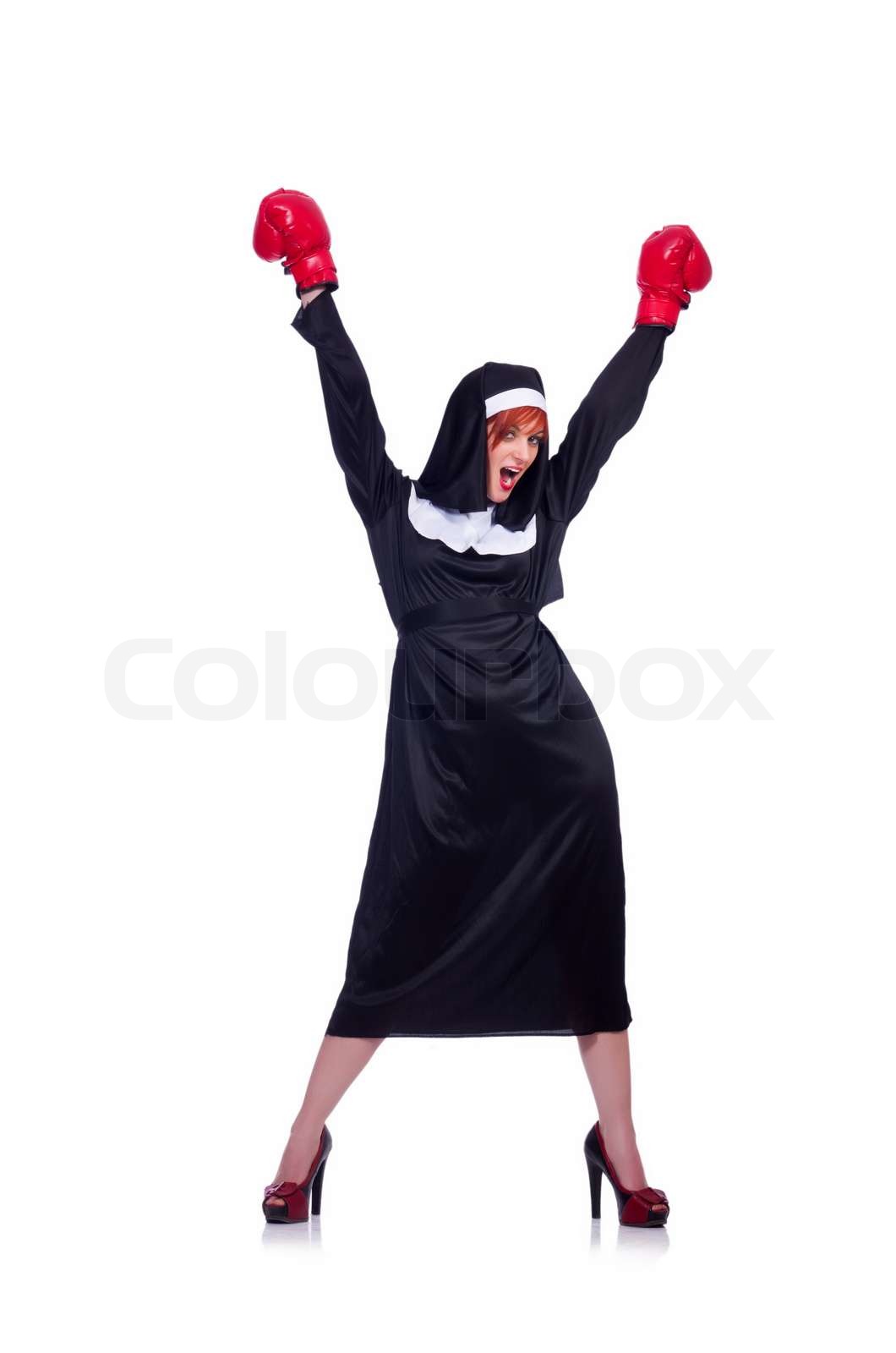 Nun with boxing gloves isolated on white | Stock image | Colourbox