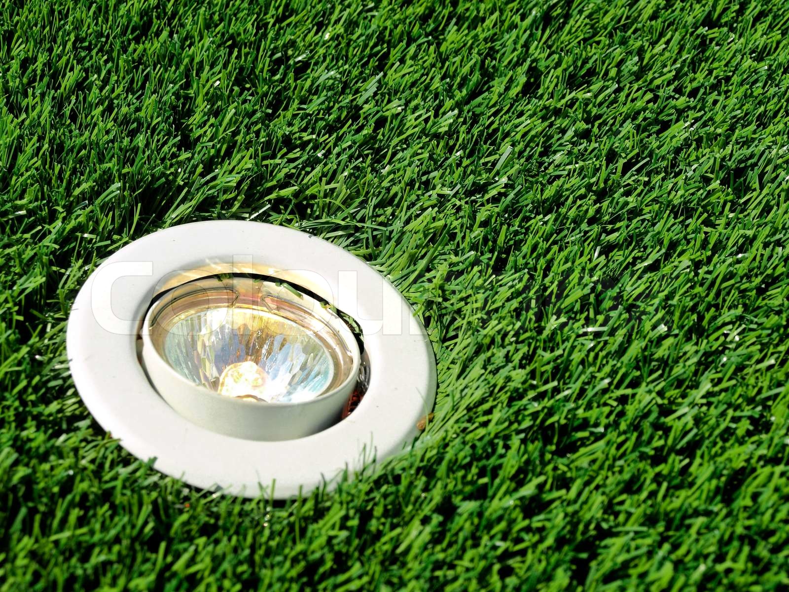 Green energy concept - Friendly light on artificial grass | Stock image ...