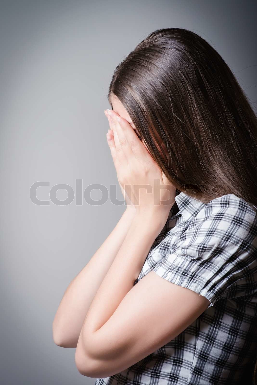 girl covers her face | Stock image | Colourbox