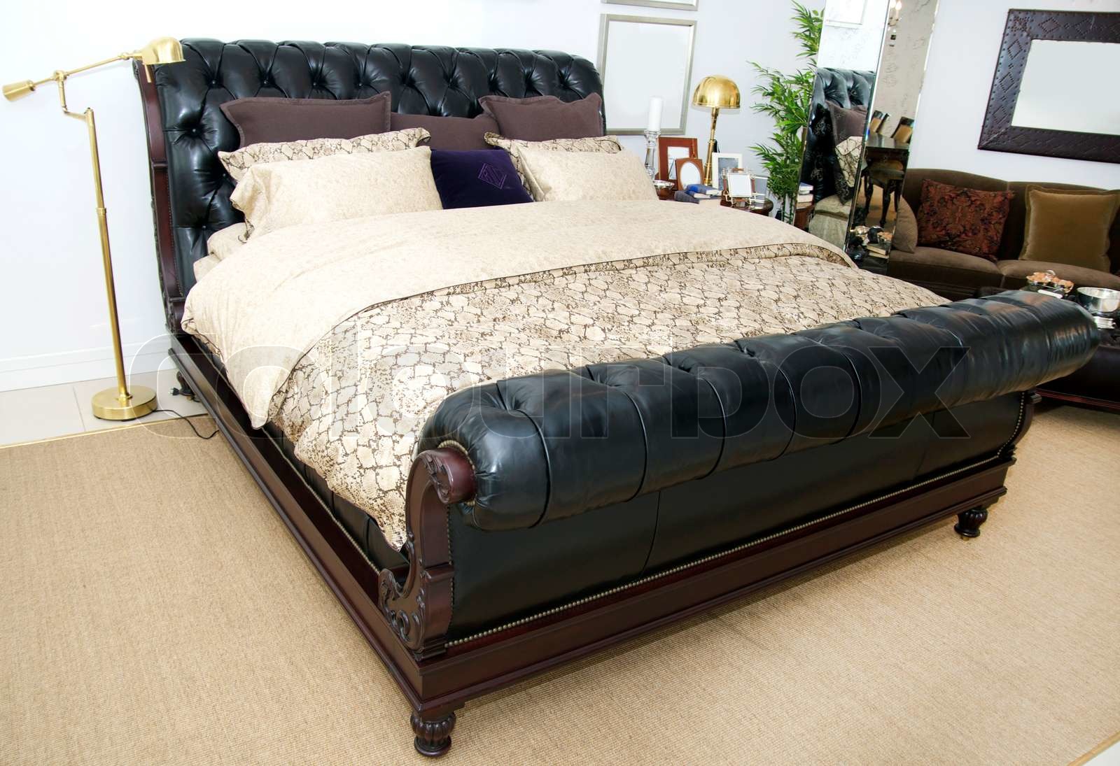 bedroom with a queen size bed and bedside table | Stock image | Colourbox