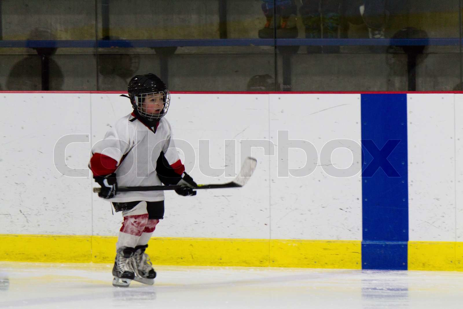 Child playing ice hockey | Stock image | Colourbox