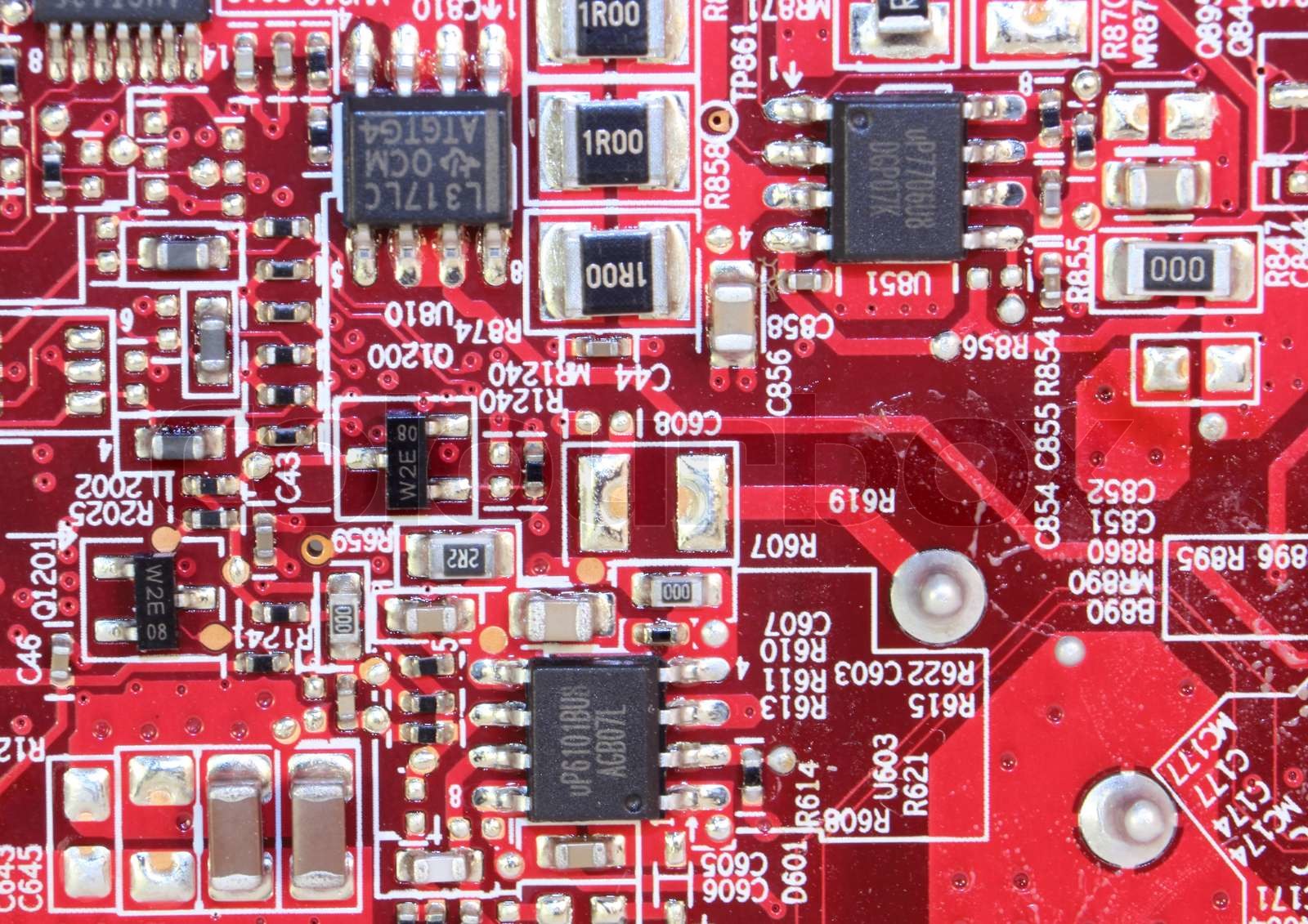 Red printed electronic circuit board with small mounted device | Stock ...