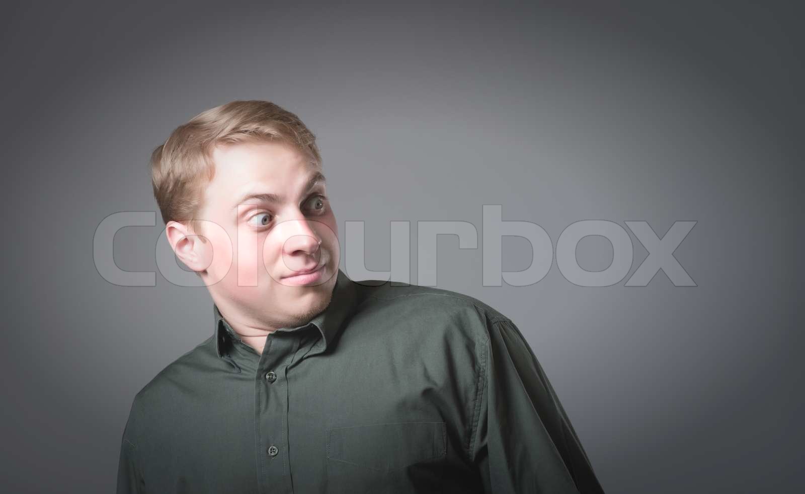 Scared man reaching up | Stock image | Colourbox