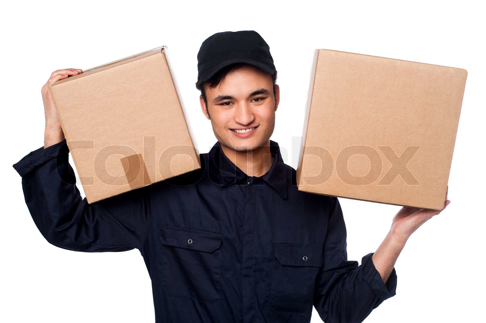 Young delivery boy at work Carrying carton boxes on shoulders | Stock ...
