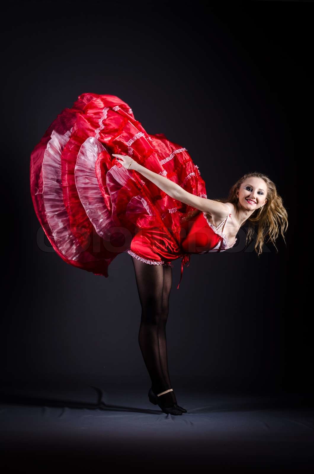 Girl in red dress dancing dance | Stock image | Colourbox