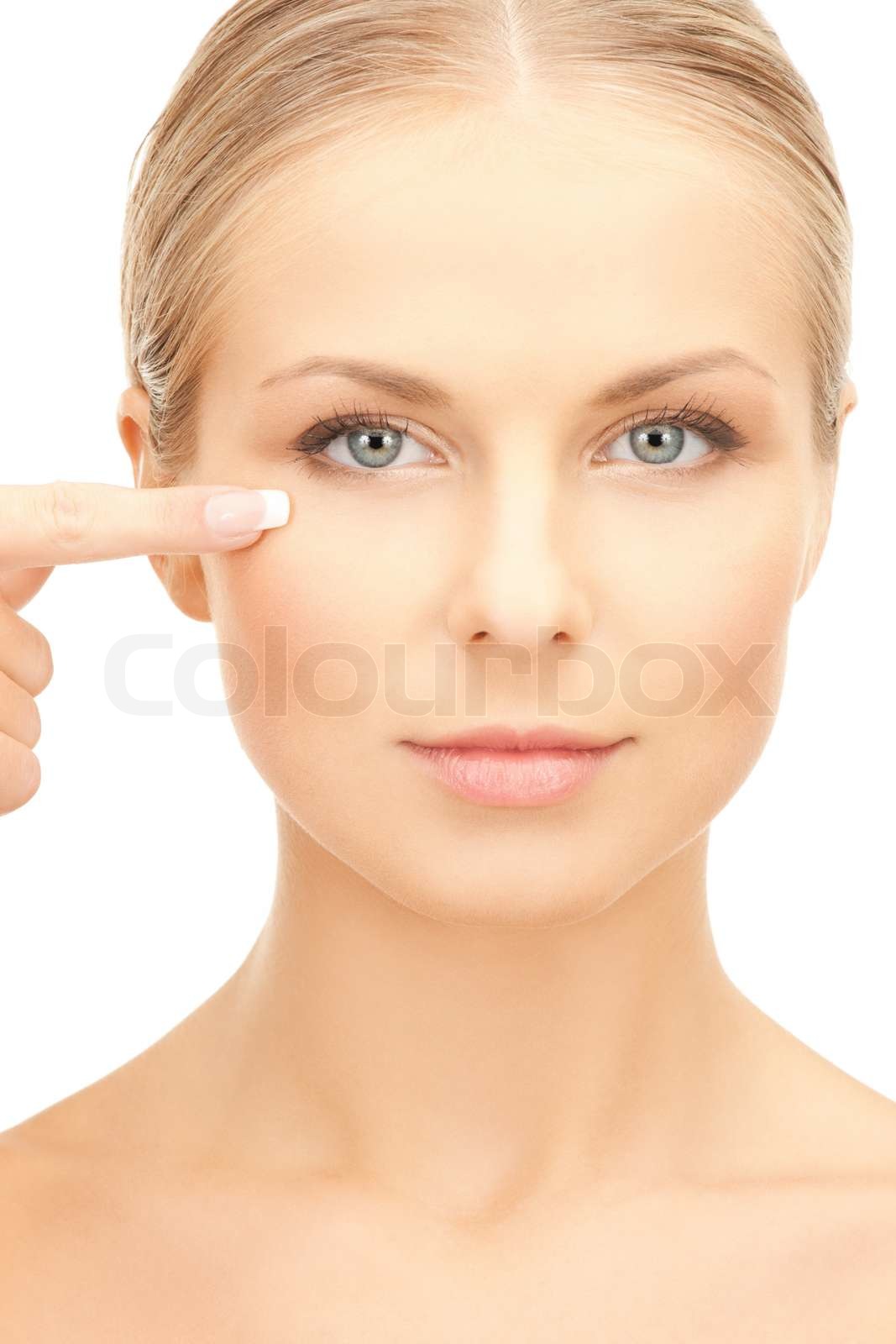 beautiful woman touching her eye area | Stock image | Colourbox