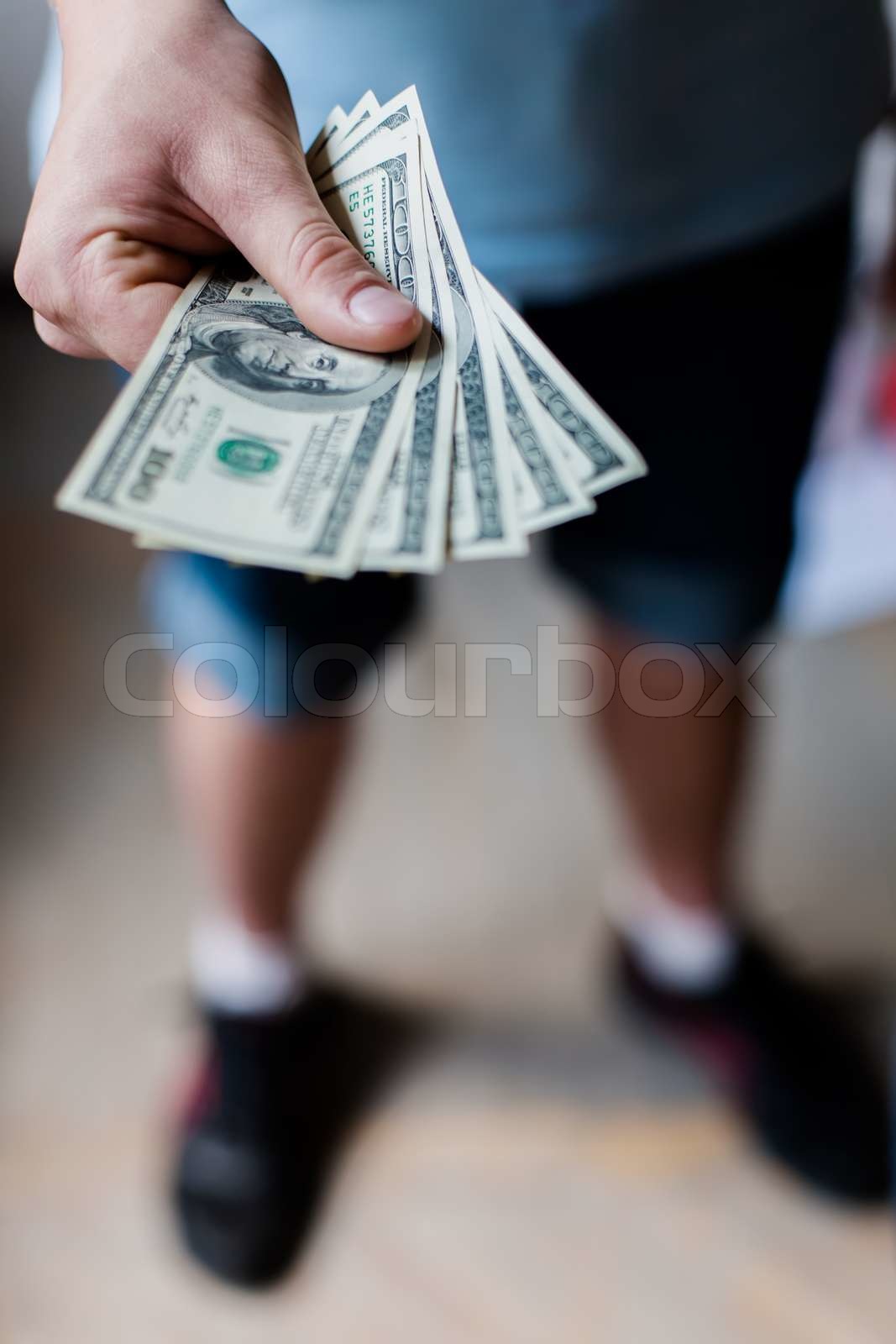 Man holder amerikanske dollars inhands | Stock foto | Colourbox