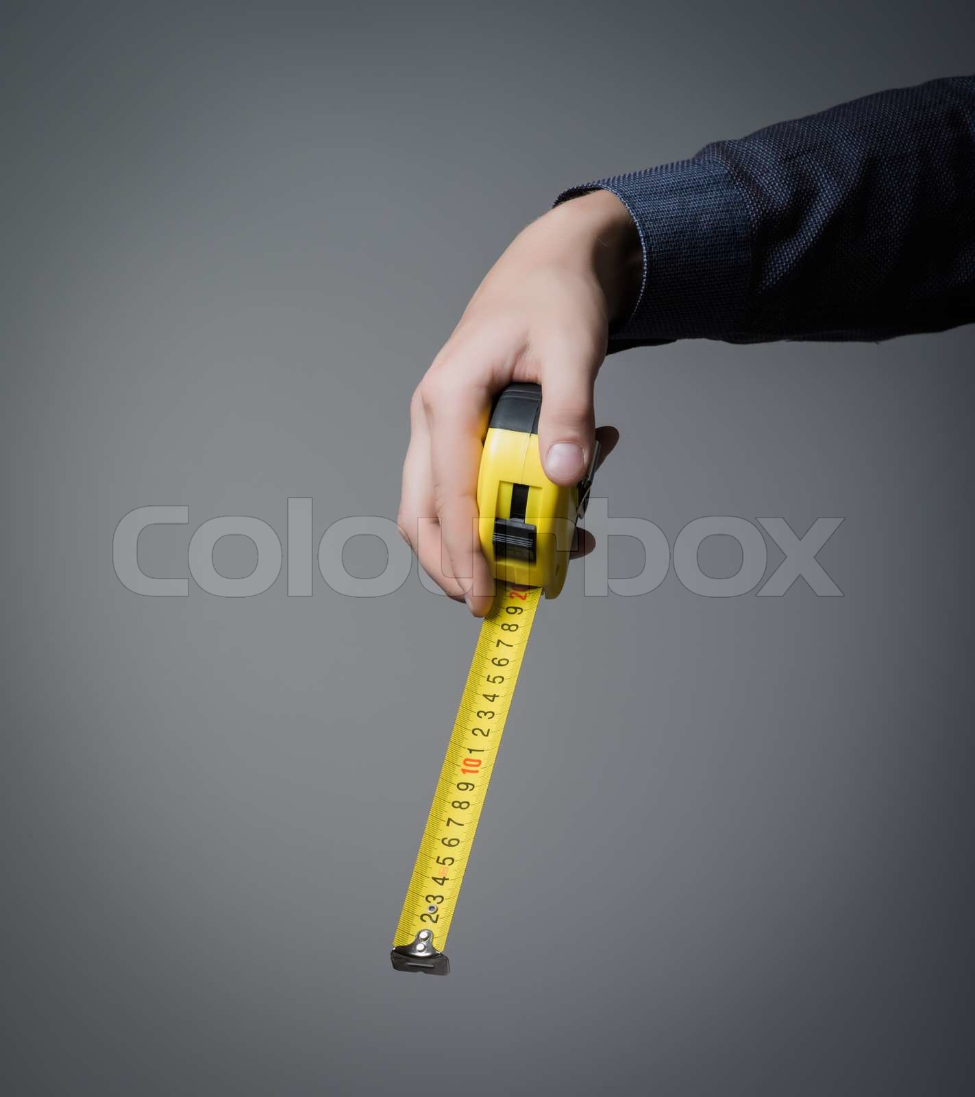 worker often with a measuring tape | Stock image | Colourbox
