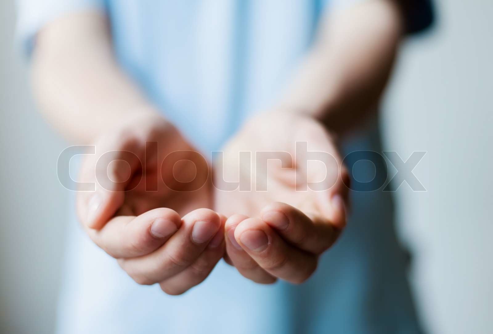Man holding something in his hands | Stock image | Colourbox