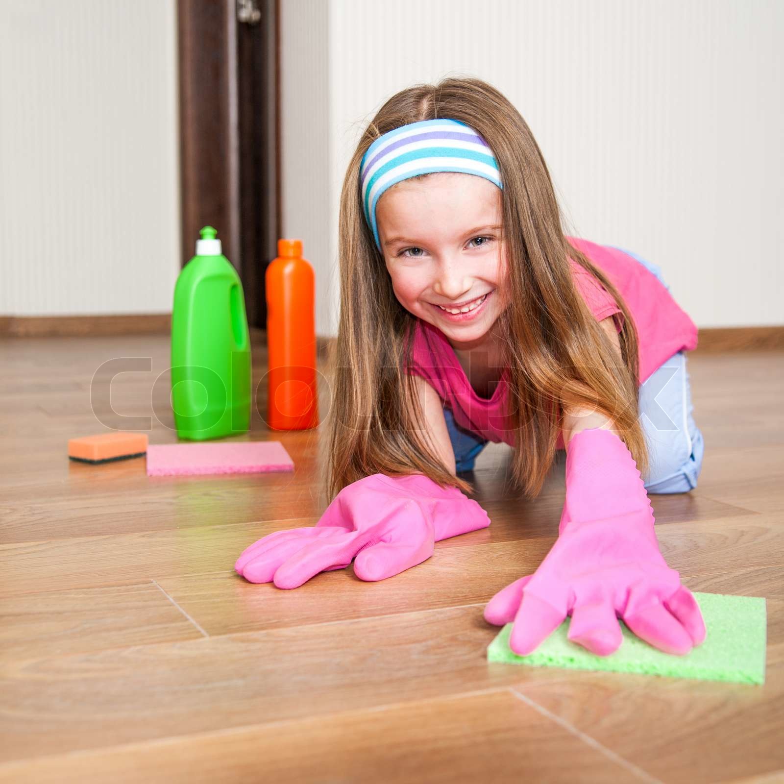 little girl cleans the house | Stock image | Colourbox
