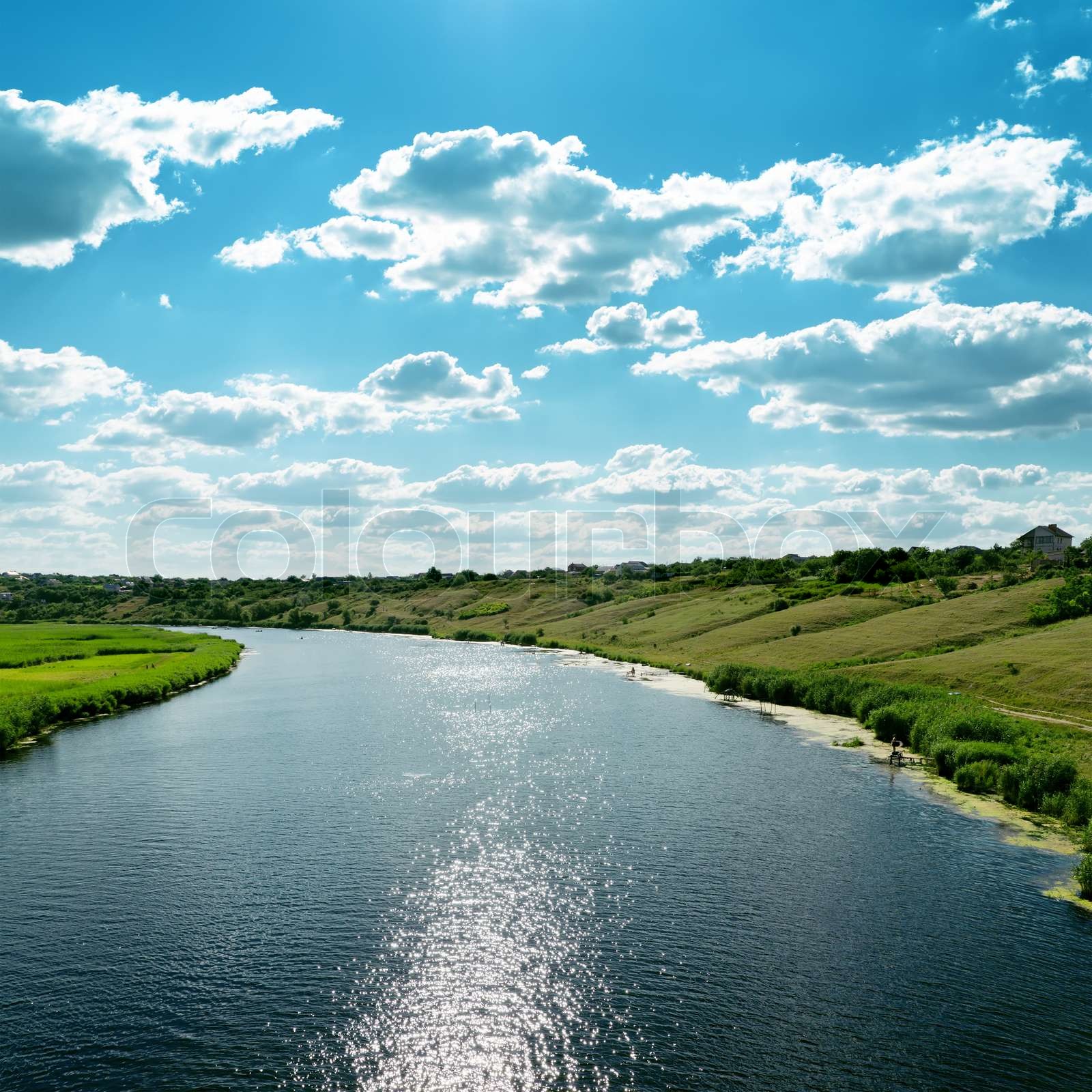 river with reflections and blue cloudy sky over it | Stock image ...