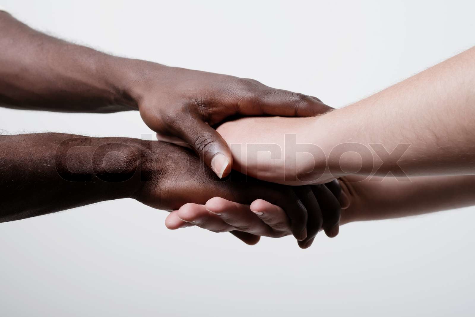 Closeup portrait of group with mixed race people with hands together ...
