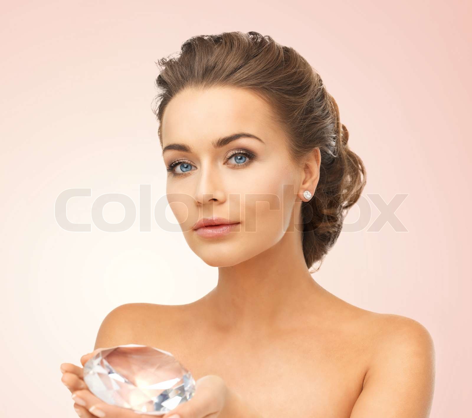 woman showing big diamond | Stock image | Colourbox