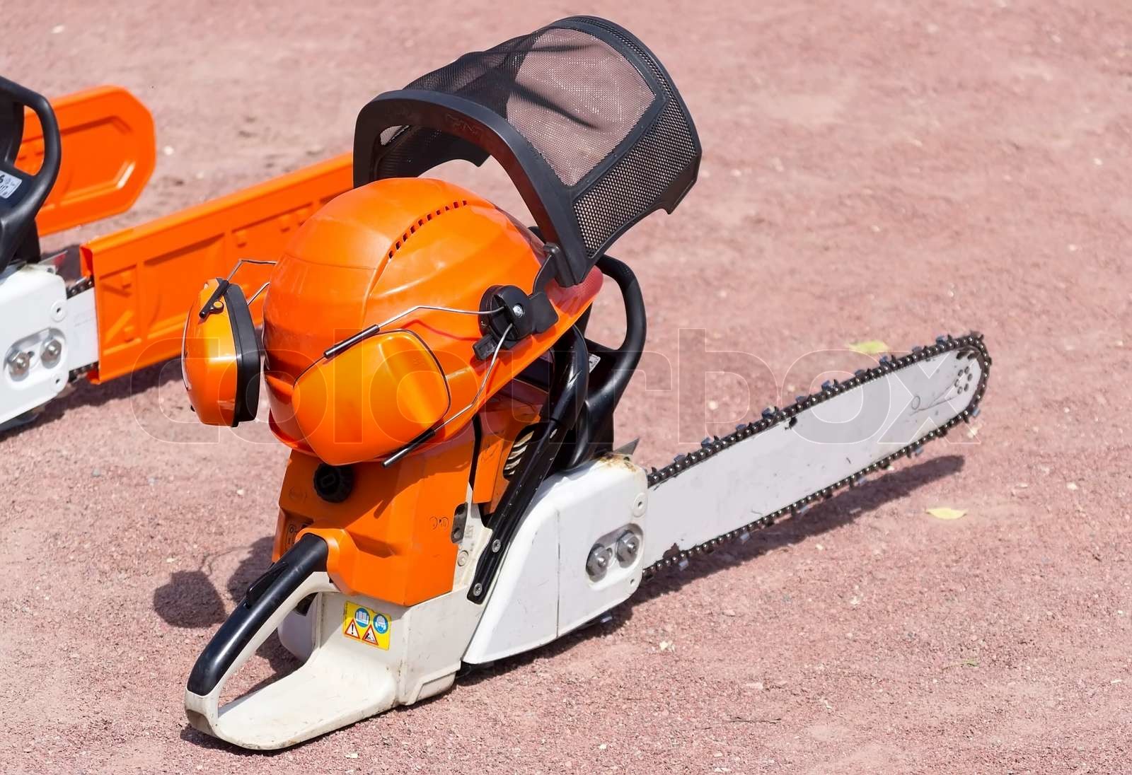 Chain saw and protective equipment for work | Stock image | Colourbox