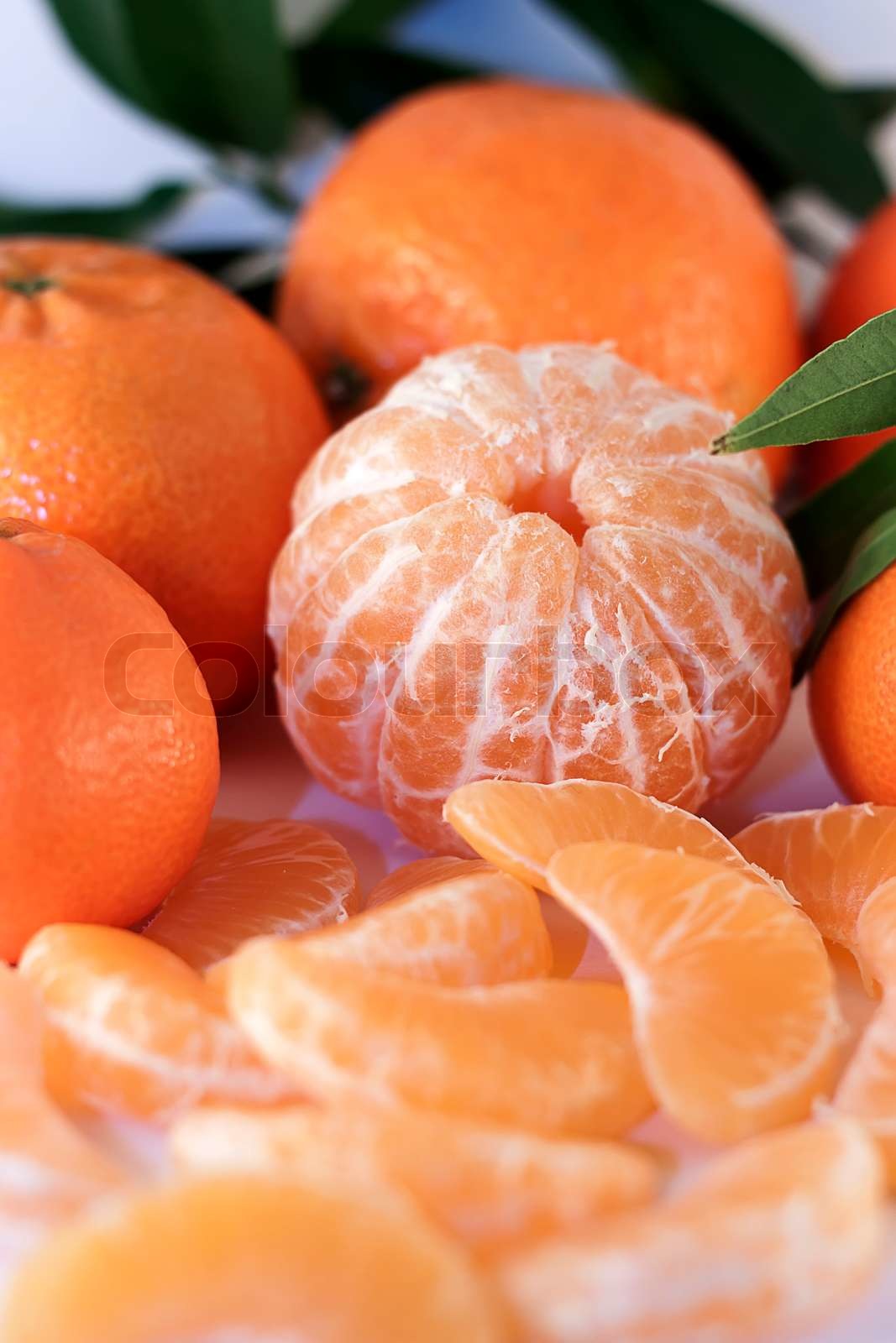 peeled mandarin and slices | Stock image | Colourbox