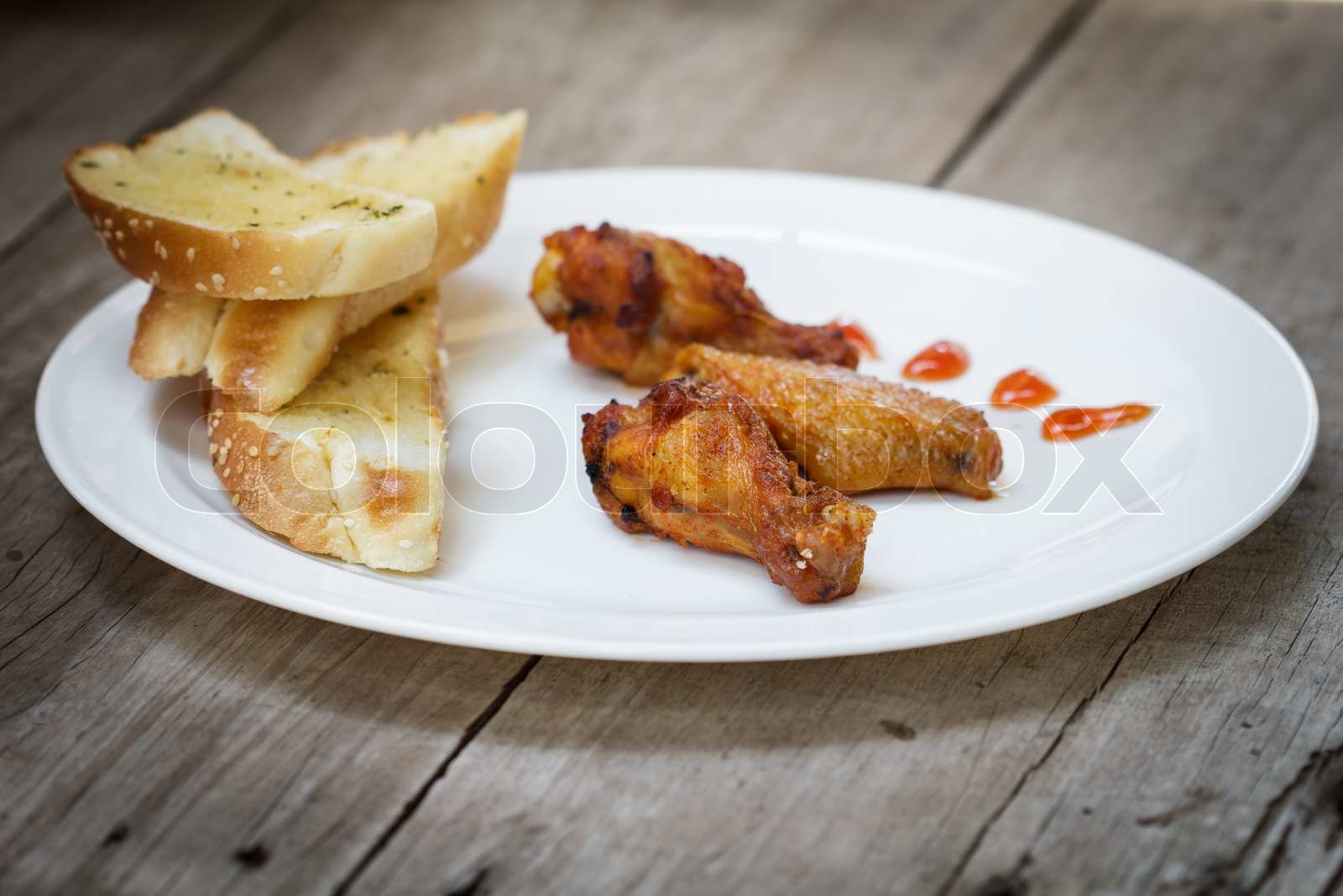 Fried chicken and garlic bread | Stock image | Colourbox