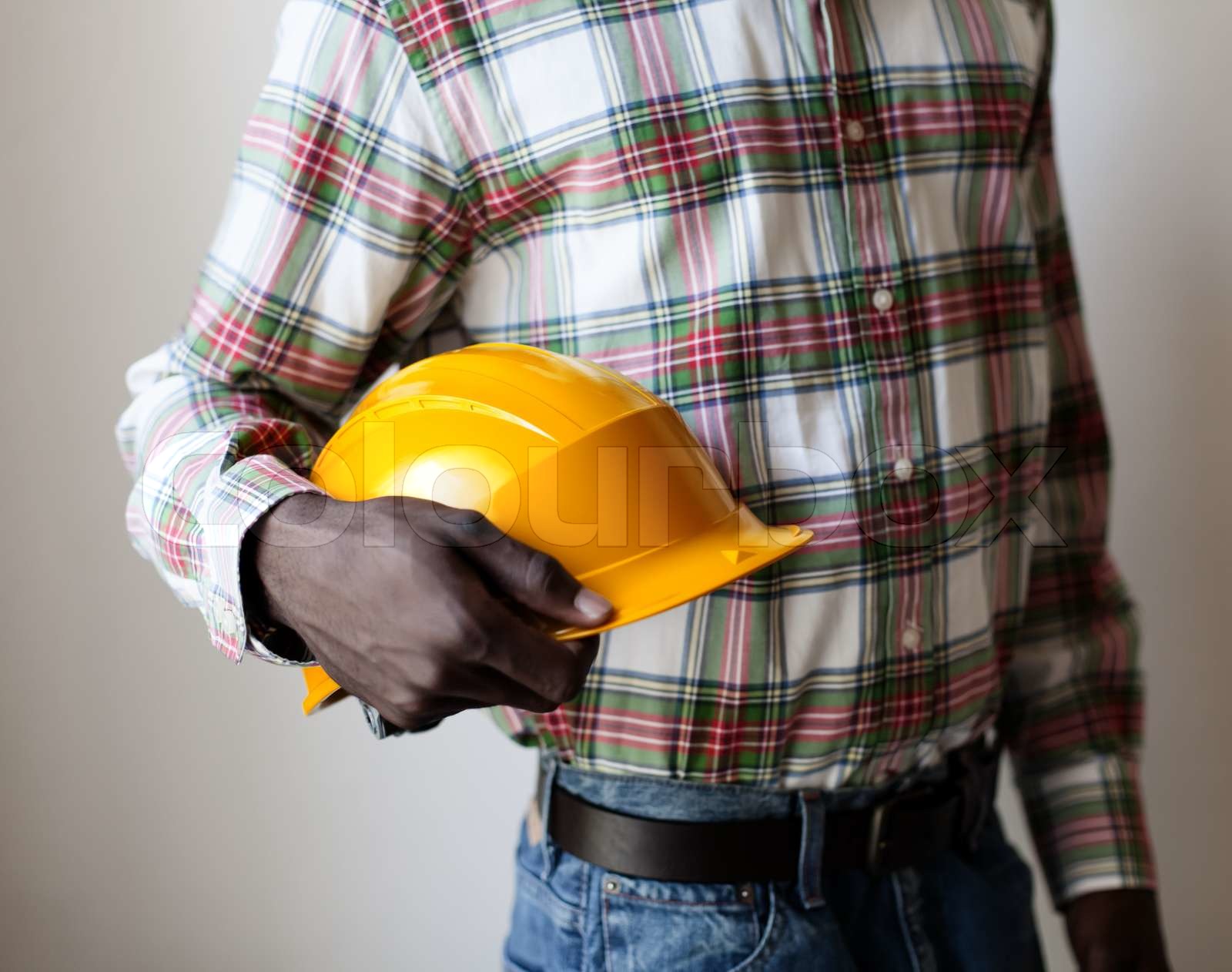 African American with construction helmet | Stock image | Colourbox