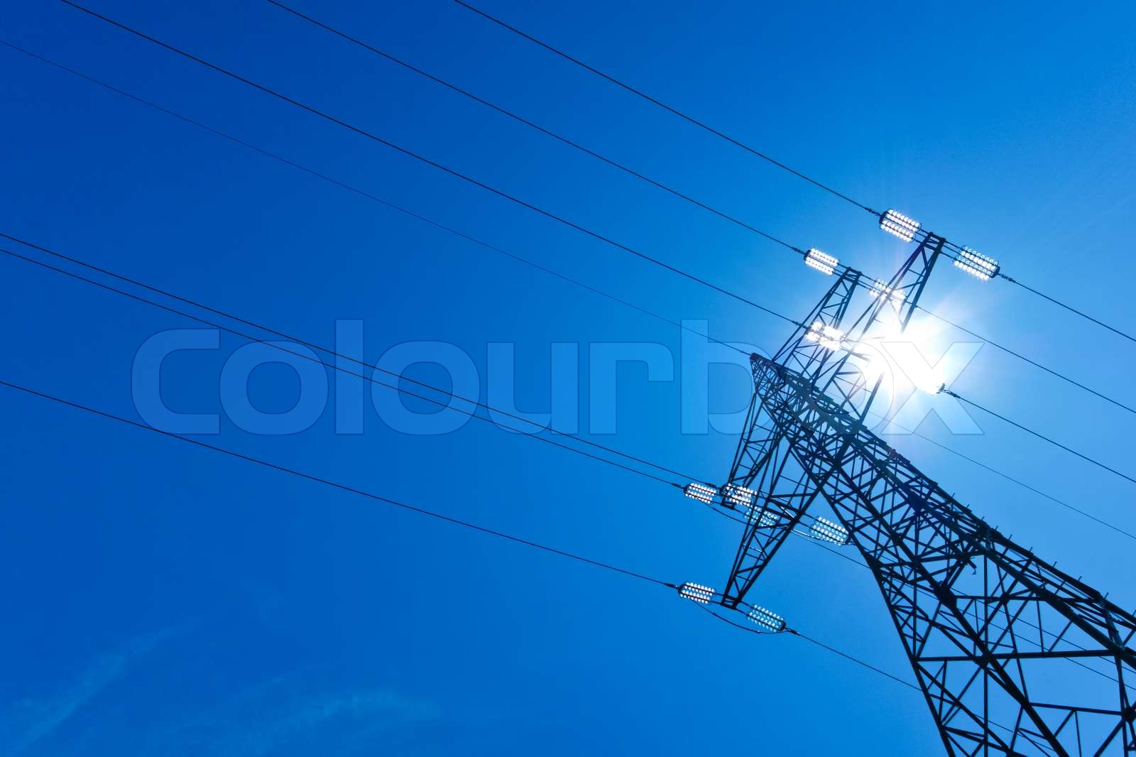 electricity pylon with sun and sky | Stock image | Colourbox