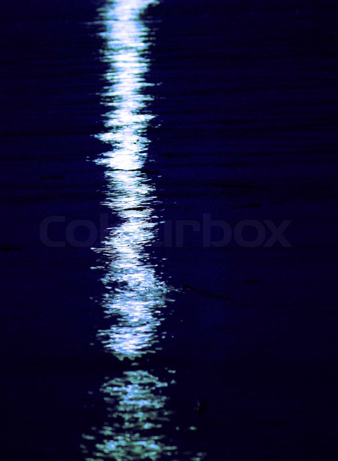 Moon light reflection on calm but rippled water | Stock image | Colourbox