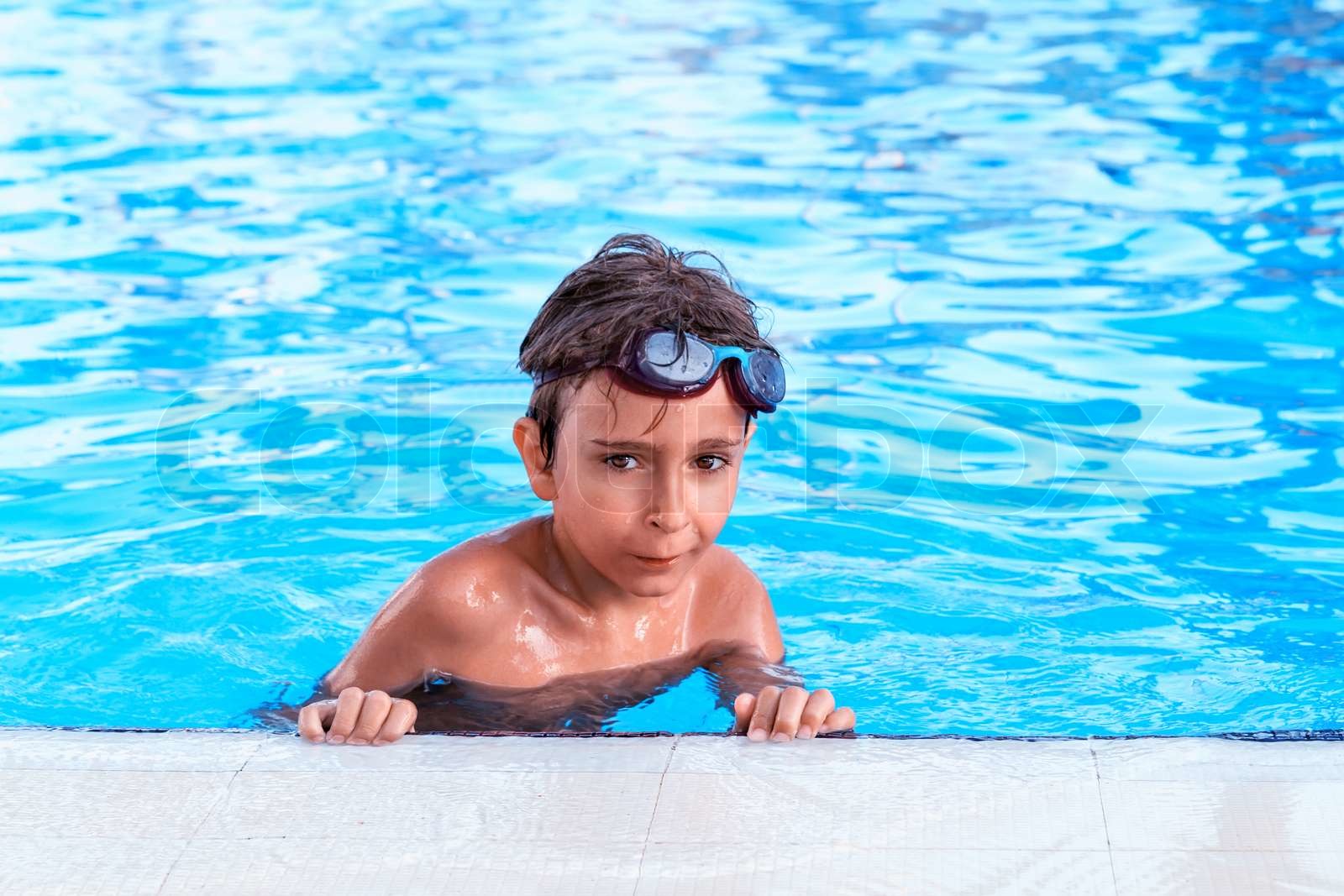 Portrait of the boy in the pool | Stock image | Colourbox