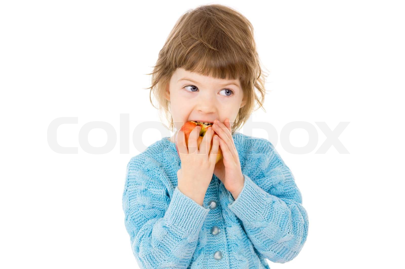 den lille pige spiser et æble | Stock foto | Colourbox