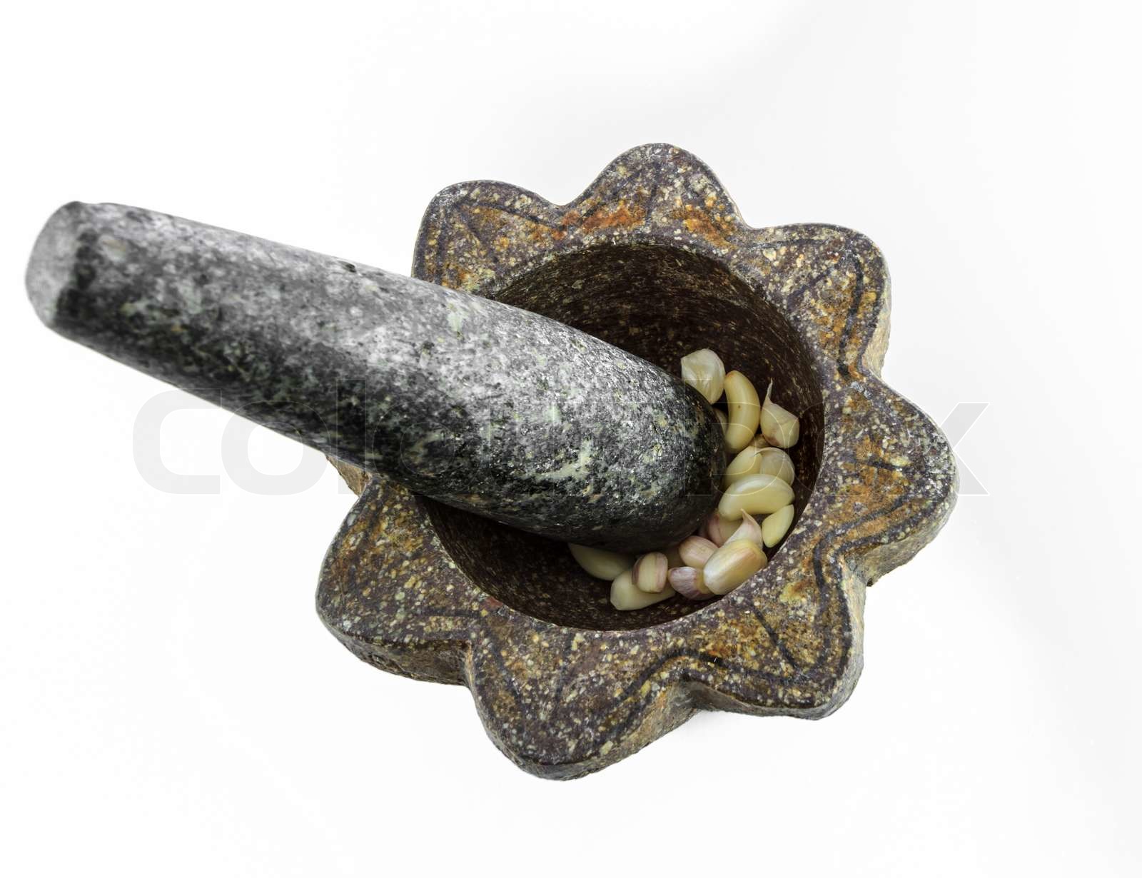 Stone Mortar with garlic isolate | Stock image | Colourbox