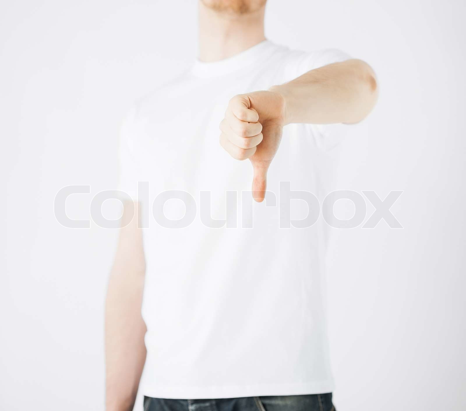 man showing thumbs down | Stock image | Colourbox