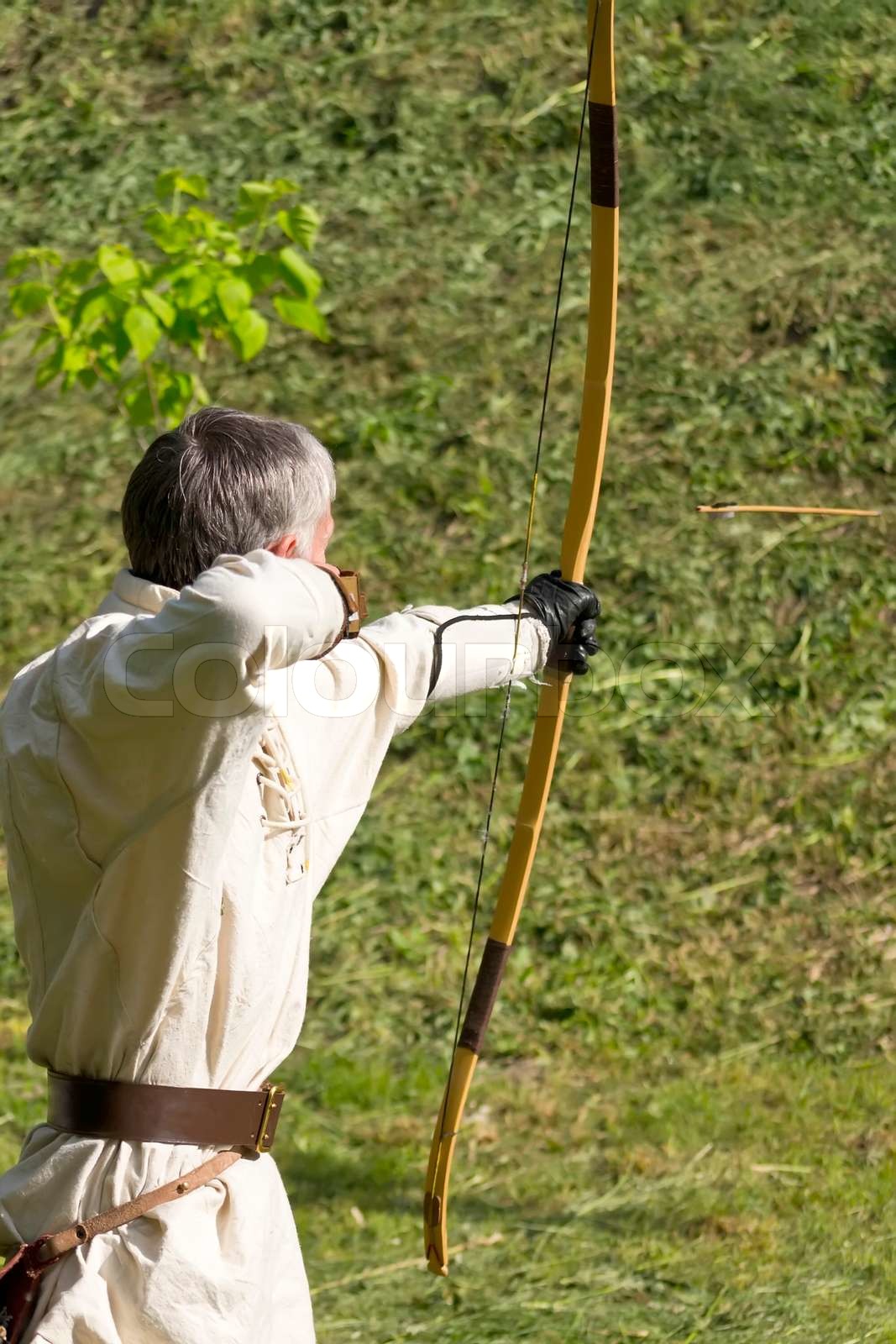 man shoots and classic bow | Stock image | Colourbox