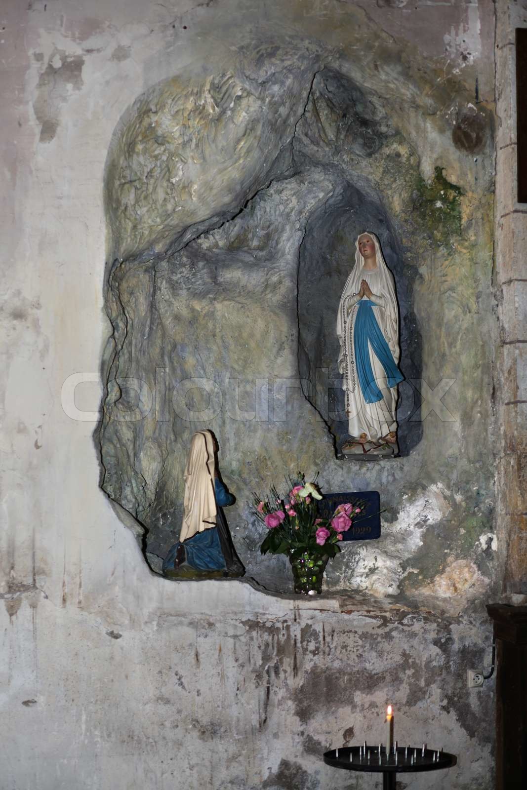 Catholic figurines praying in cave Christianity | Stock image | Colourbox