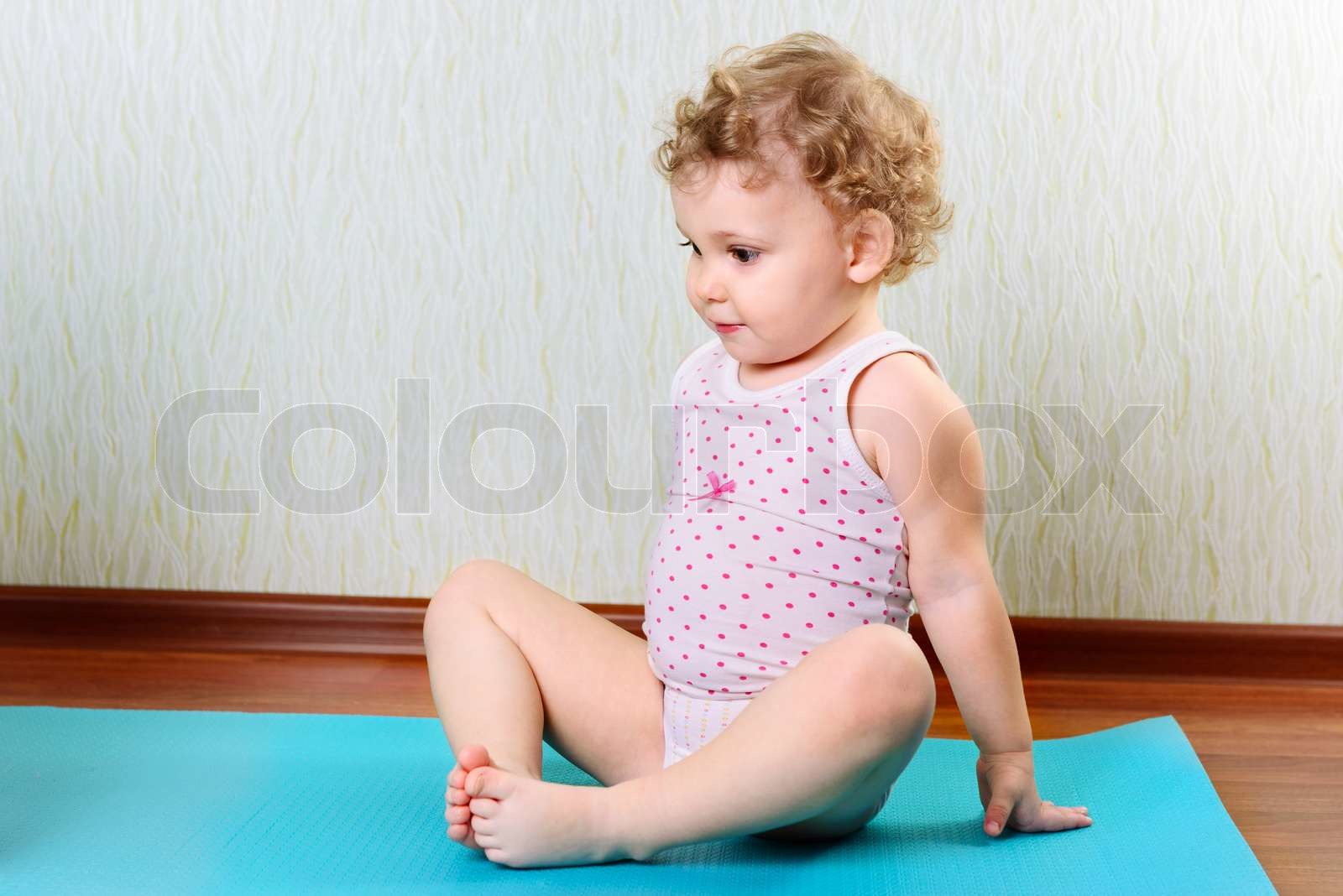 Cute little girl exercising in gym | Stock image | Colourbox