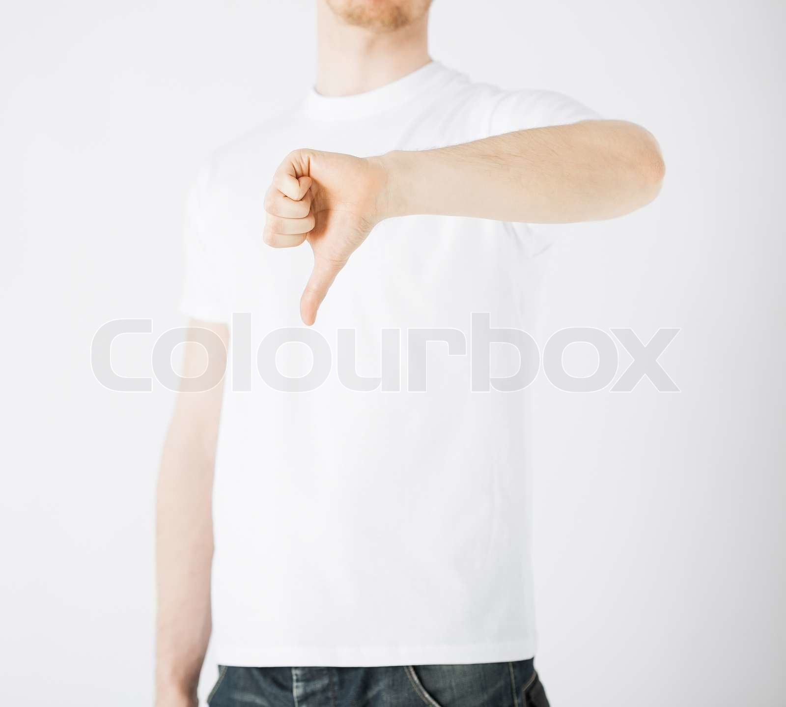 man showing thumbs down | Stock image | Colourbox