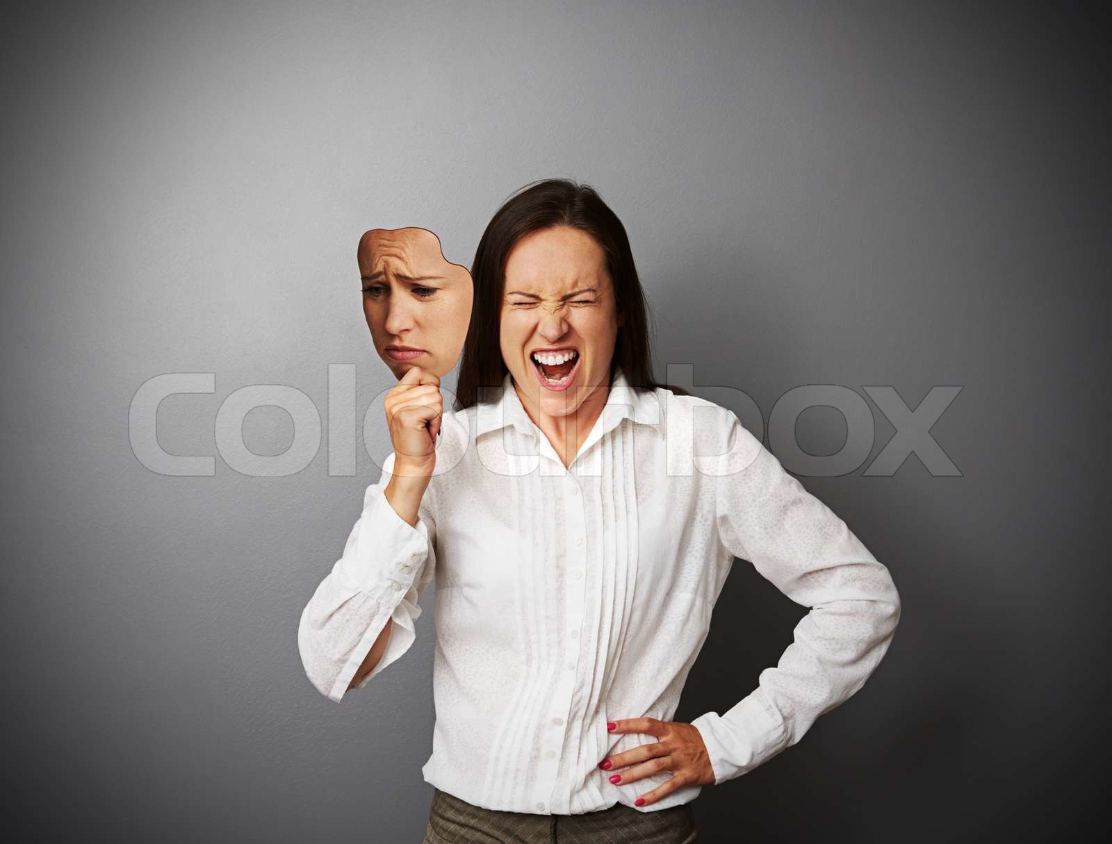 businesswoman hiding her anger | Stock image | Colourbox
