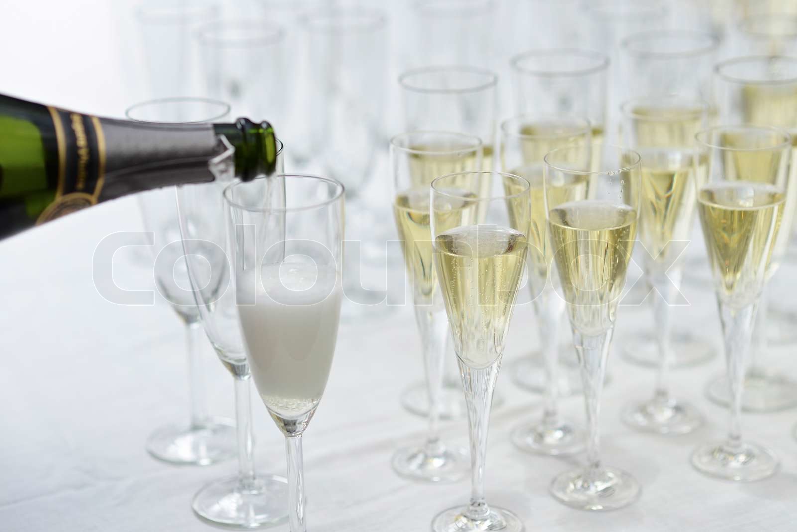 Serving champagne on celebration buffet | Stock image | Colourbox