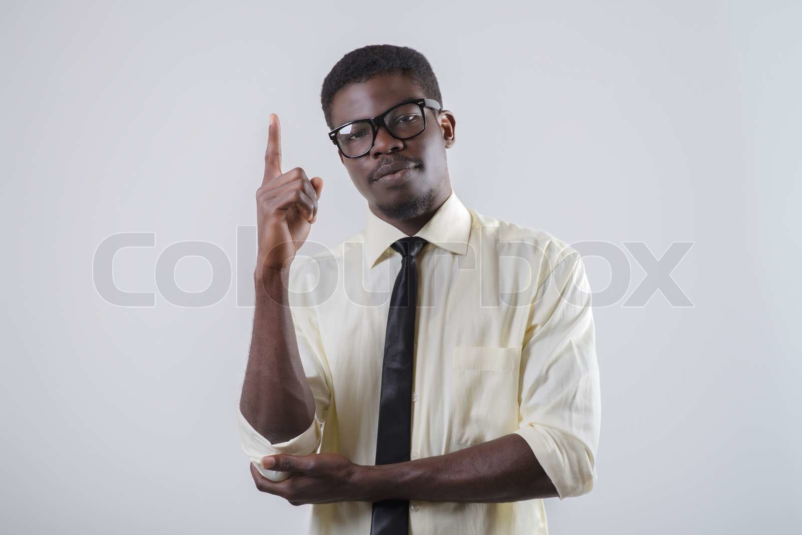 young man points his index finger | Stock image | Colourbox